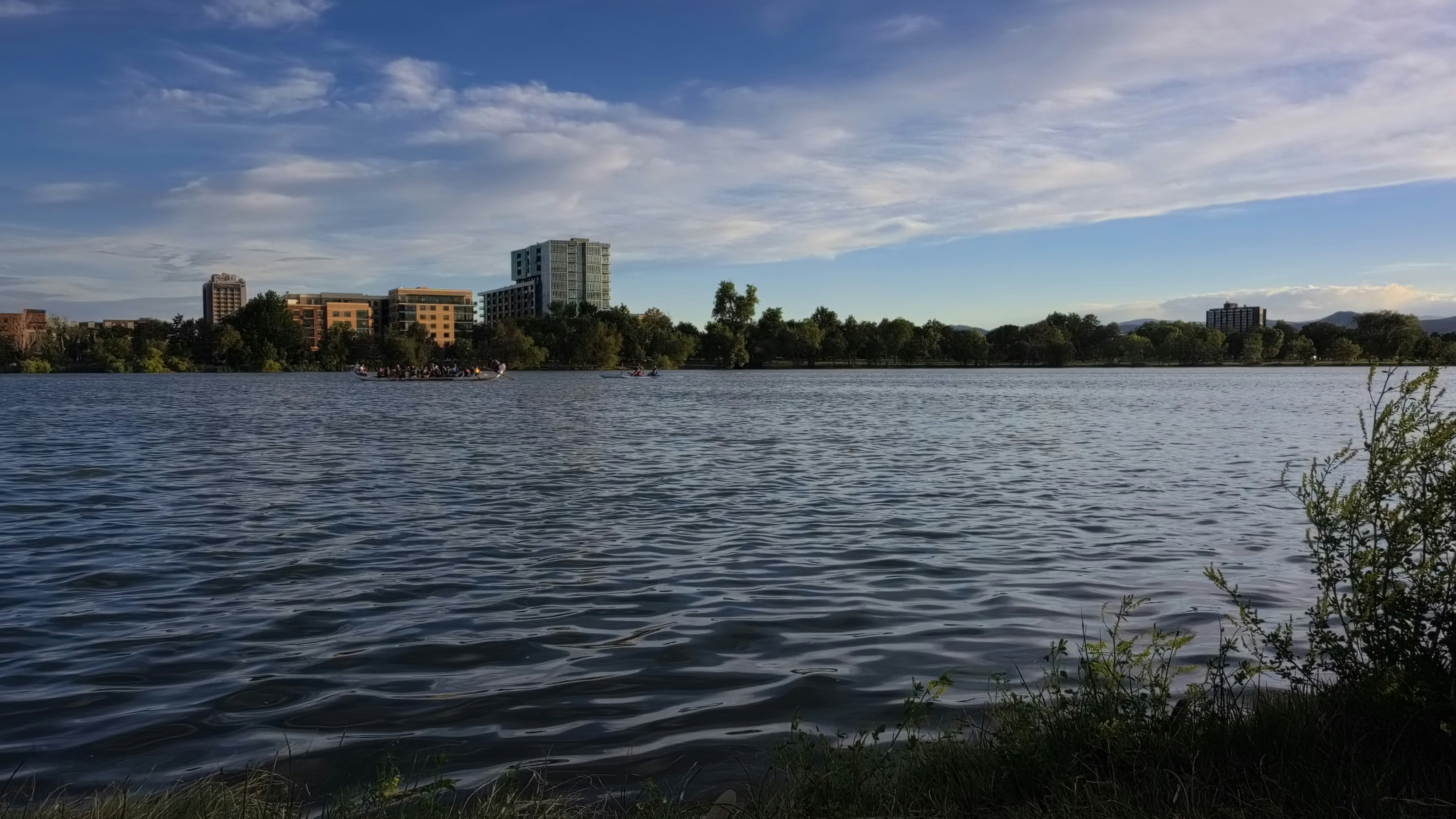 City Skyline Silhouette Across a Quiet Lake at Dusk