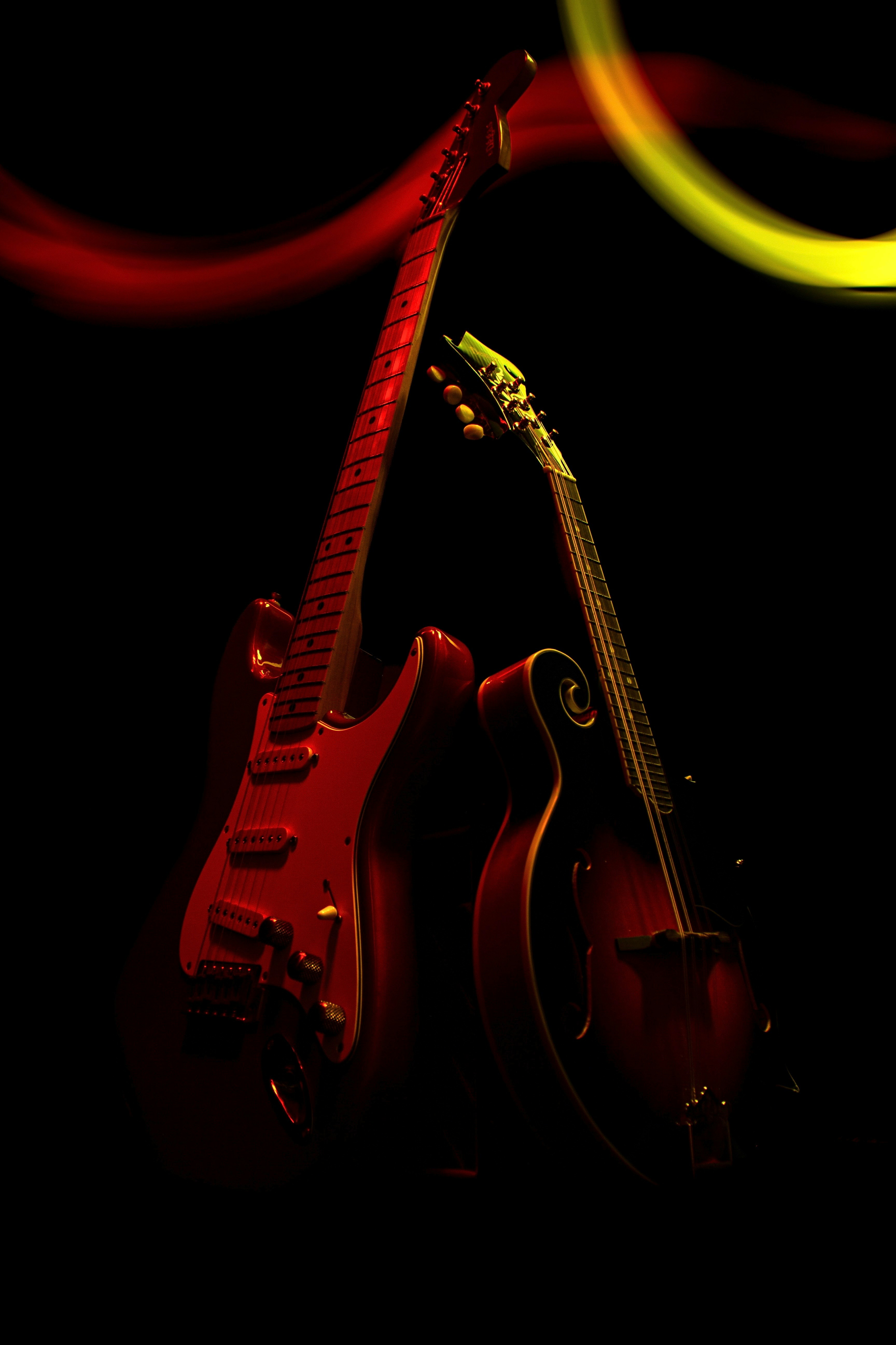 Neon-Red Duo: Guitars Lean Into the Dark Stage