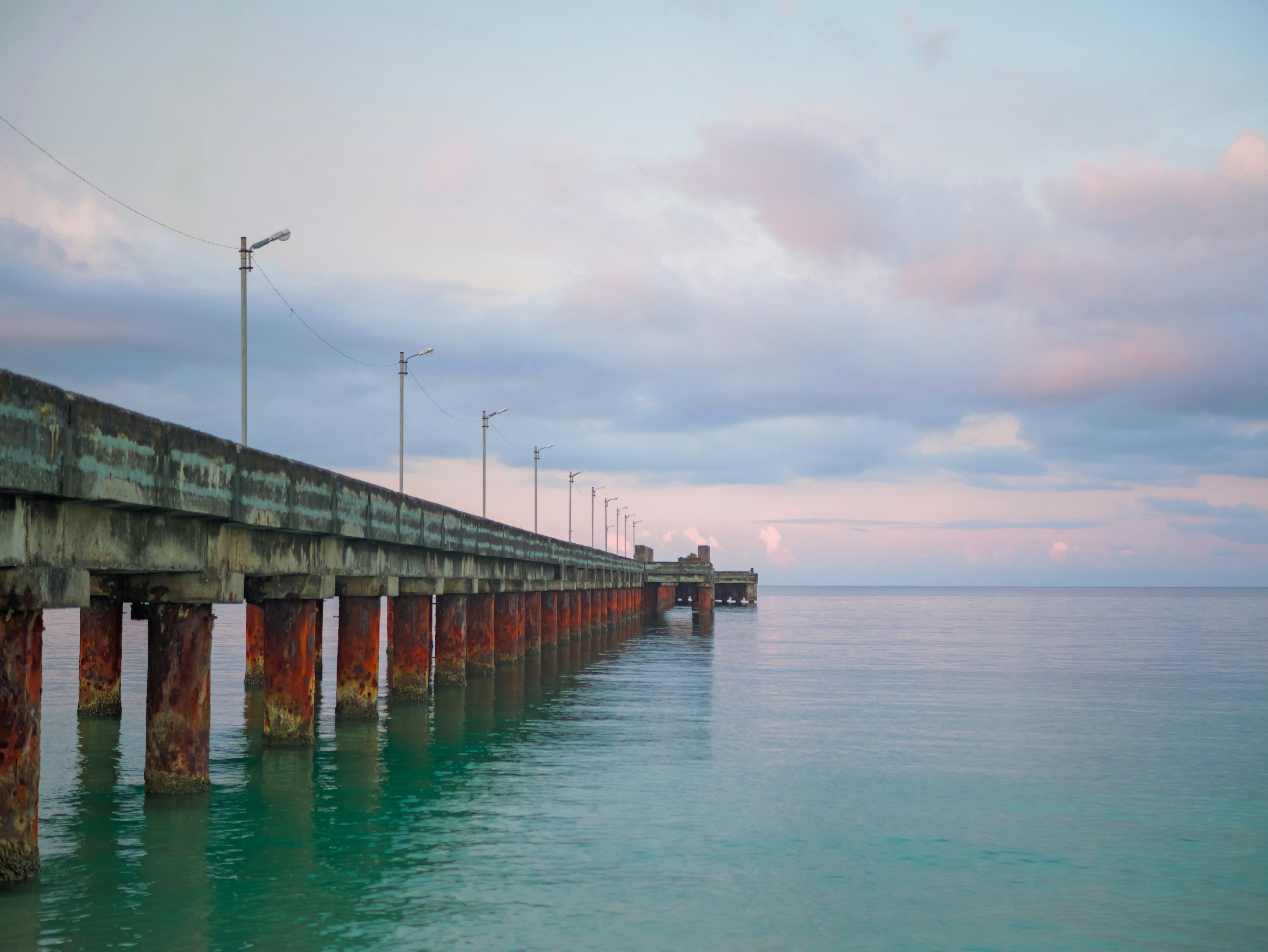 Pier Reaches into a Pacific Canvas at Dusk