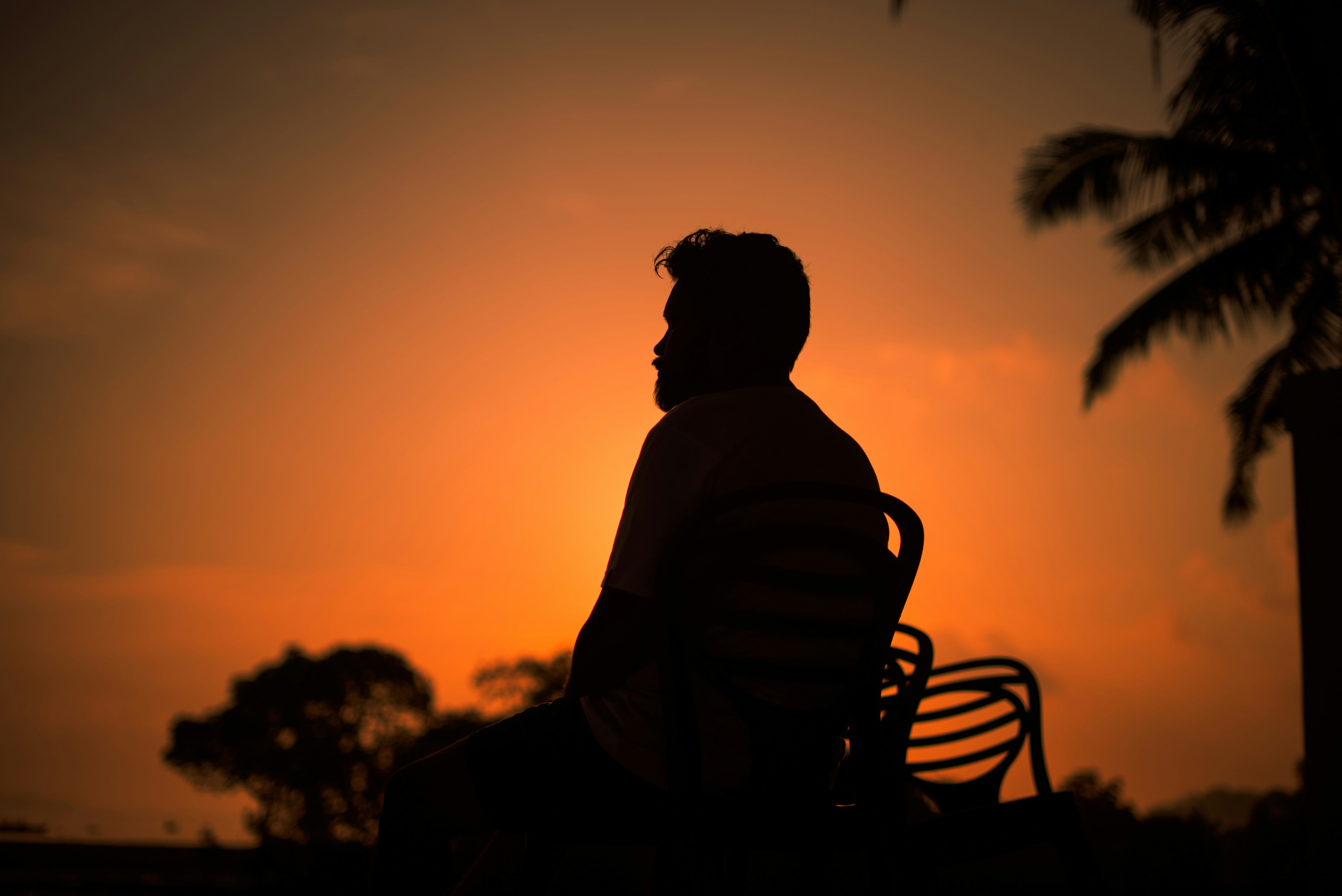 Silhouette at Sundown: A Quiet Moment on the Balcony