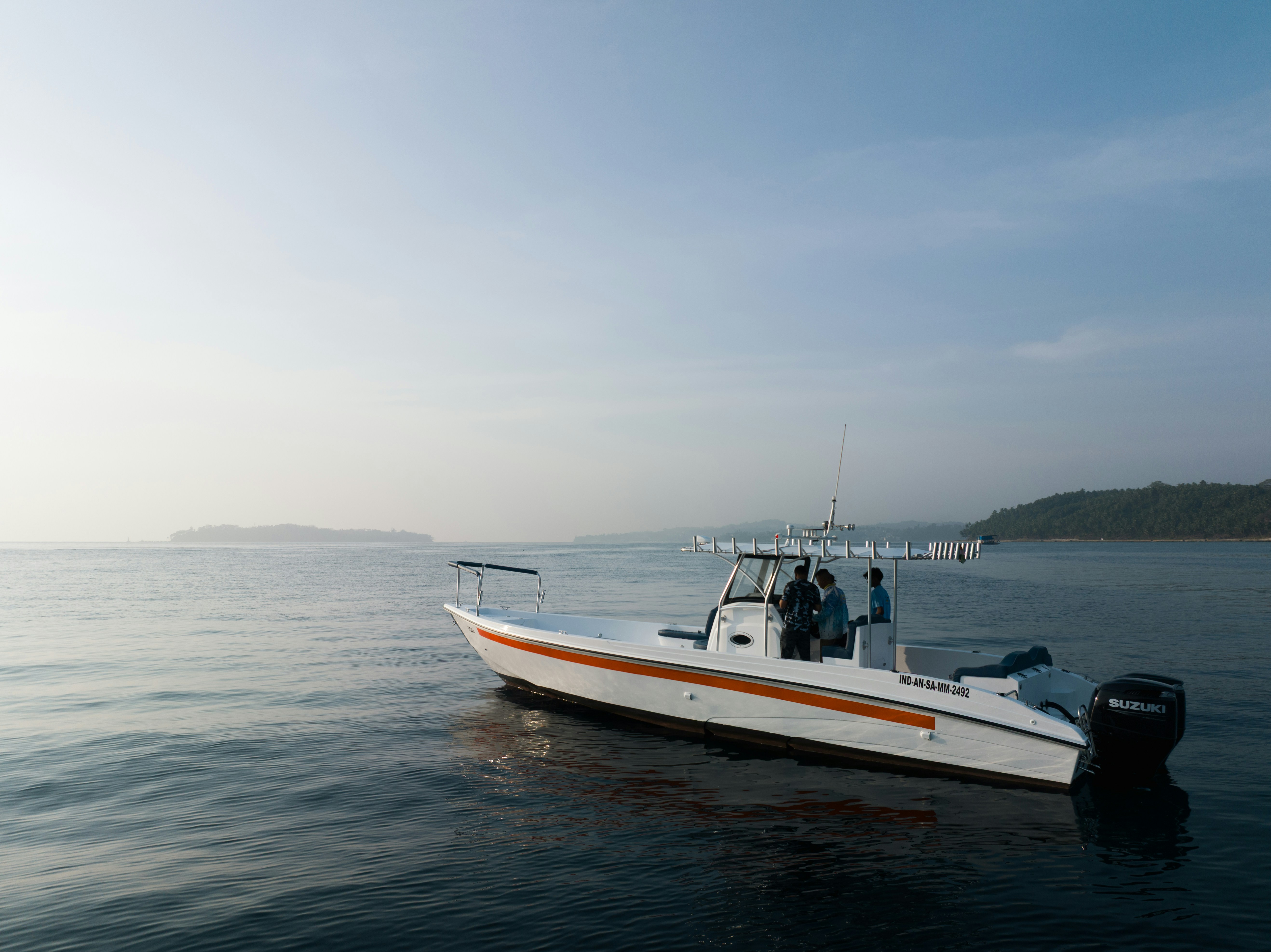 Coastal Workboat Drifts on Calm Sea at Dusk