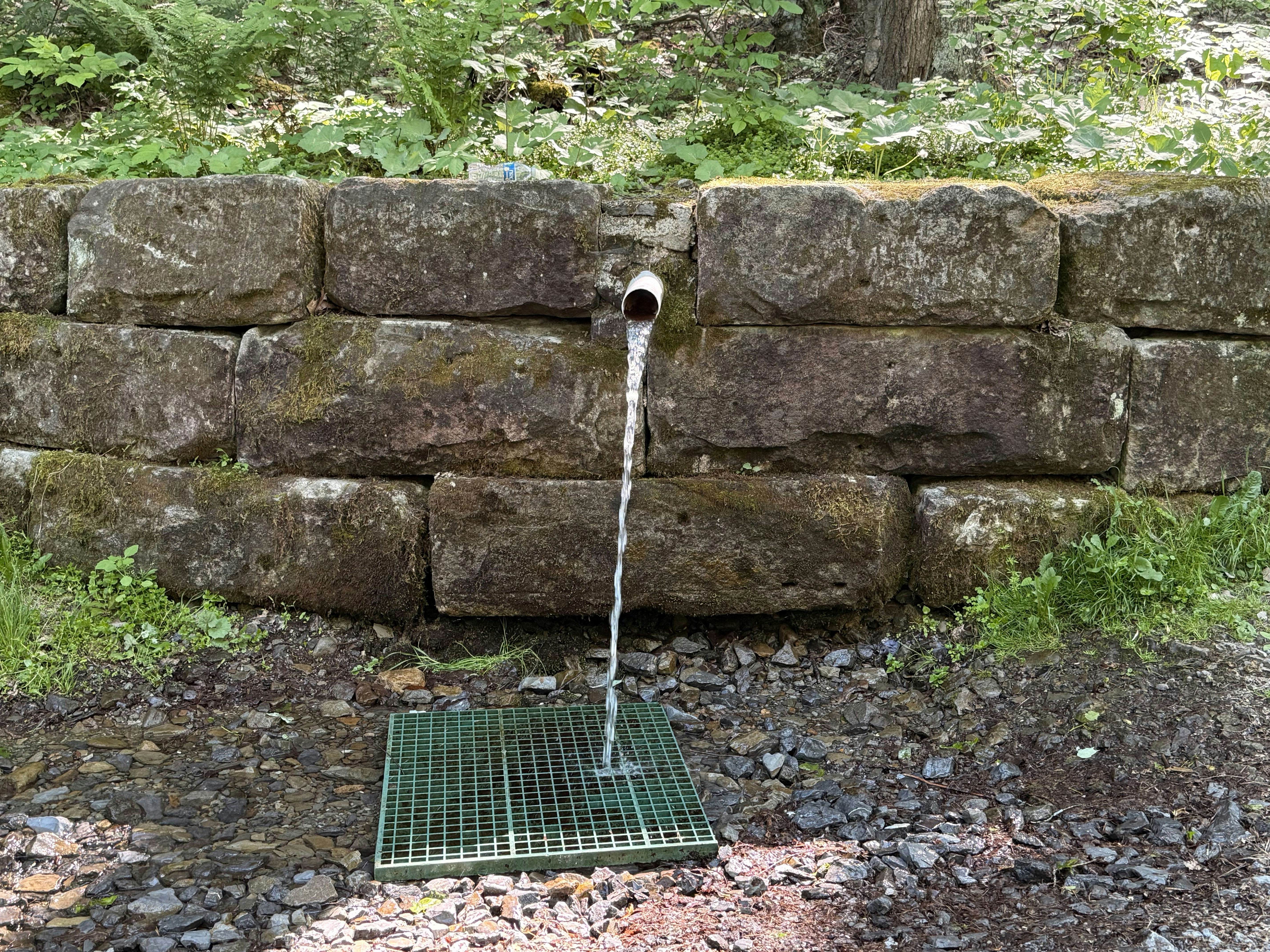 Stone Wall Fountain: A Quiet Springflow Over Mossy Blocks