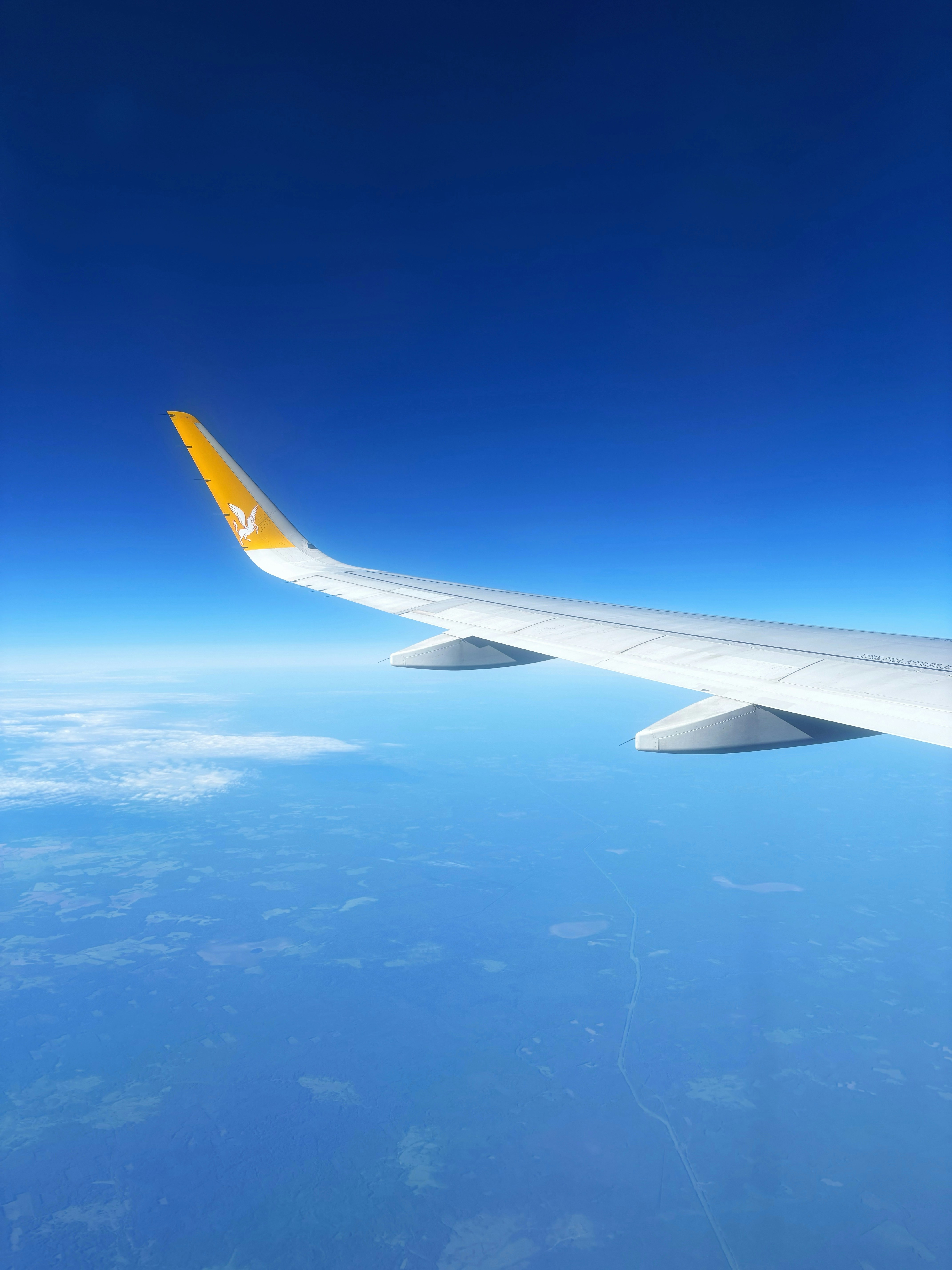 Wingtip to the Sky: A Blue-Above Perspective from Window Seat
