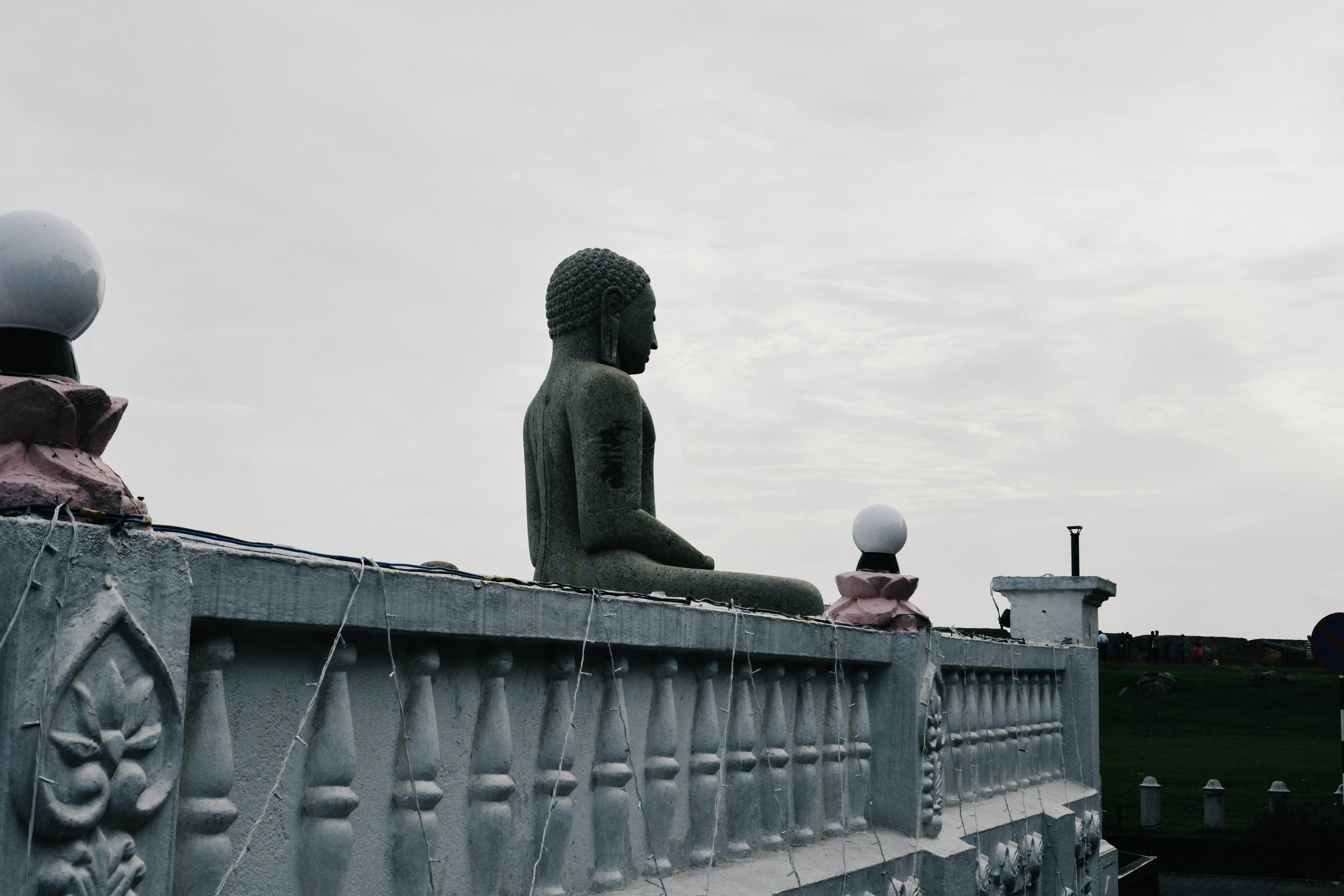 A weathered Buddha gazes beyond the walls, untouched by the passing clouds and changing years. ⸻ Fujifilm X-T5 • 27mm • ƒ/13