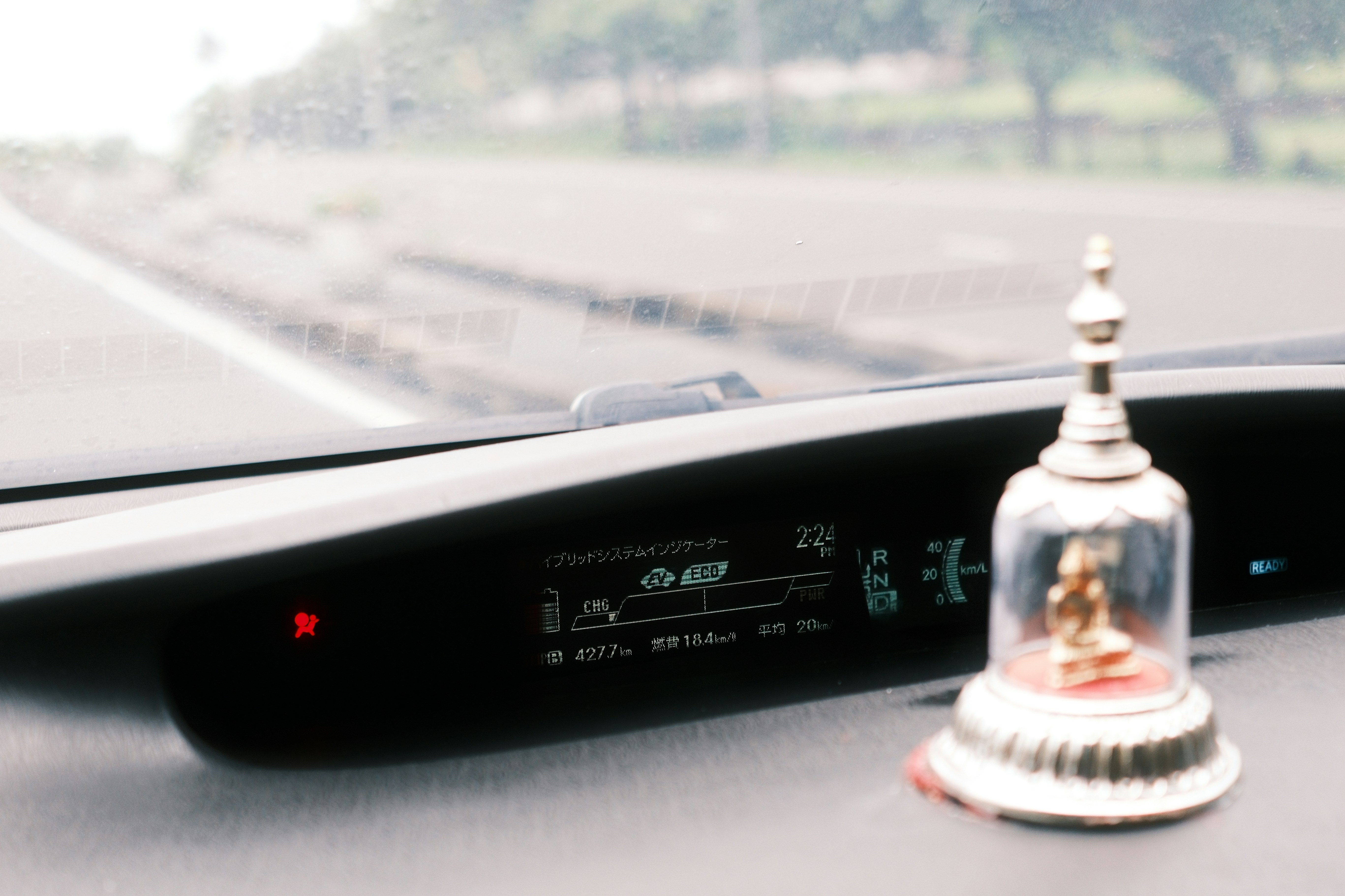 Glint of the Dash: A Tiny Shrine Rests in the Car's Center