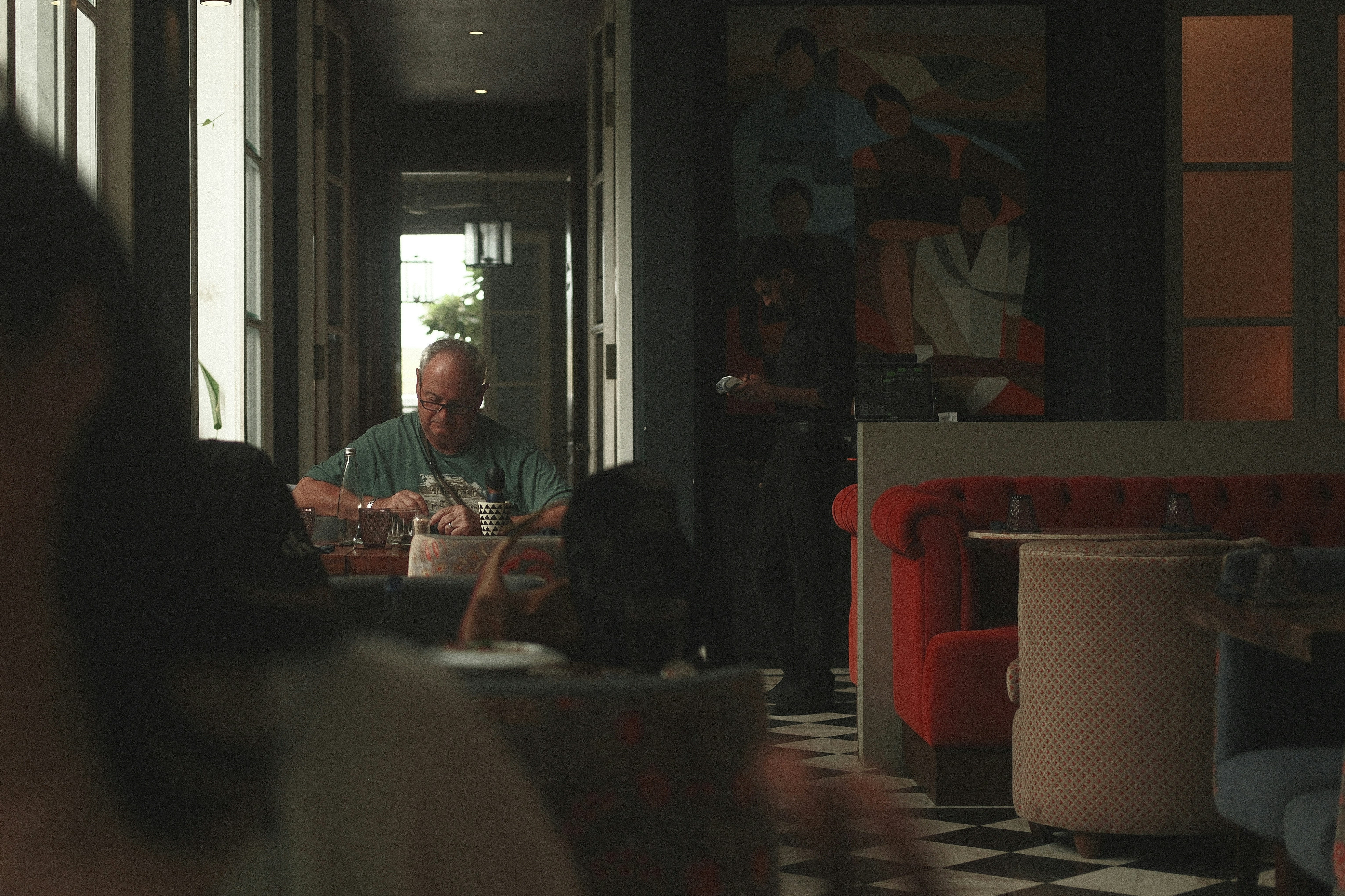 Quiet Convergence: A Reader in a Sunlit Café