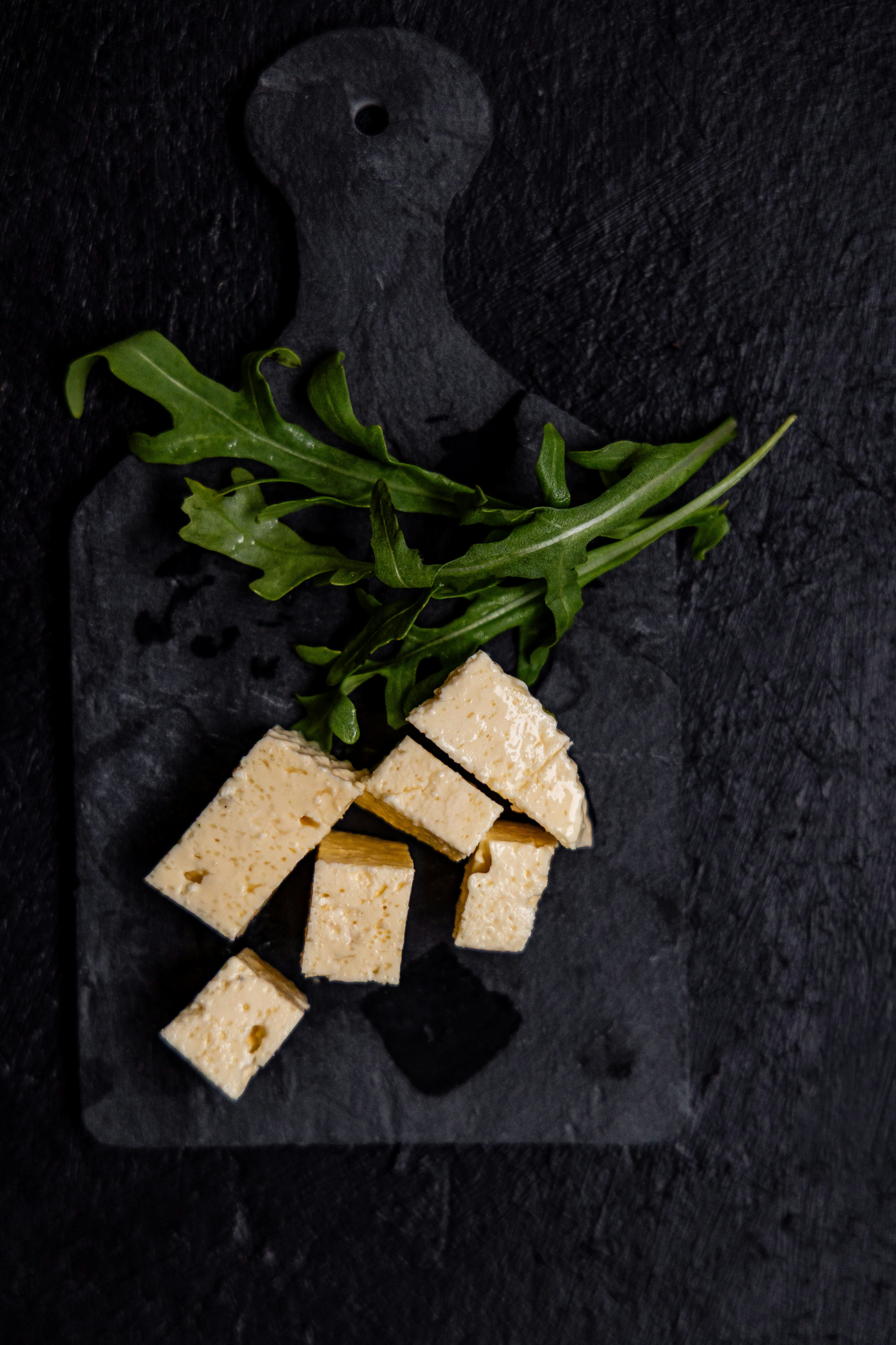 Arresting Board-Top Cheese Cuttings with Arugula Accent