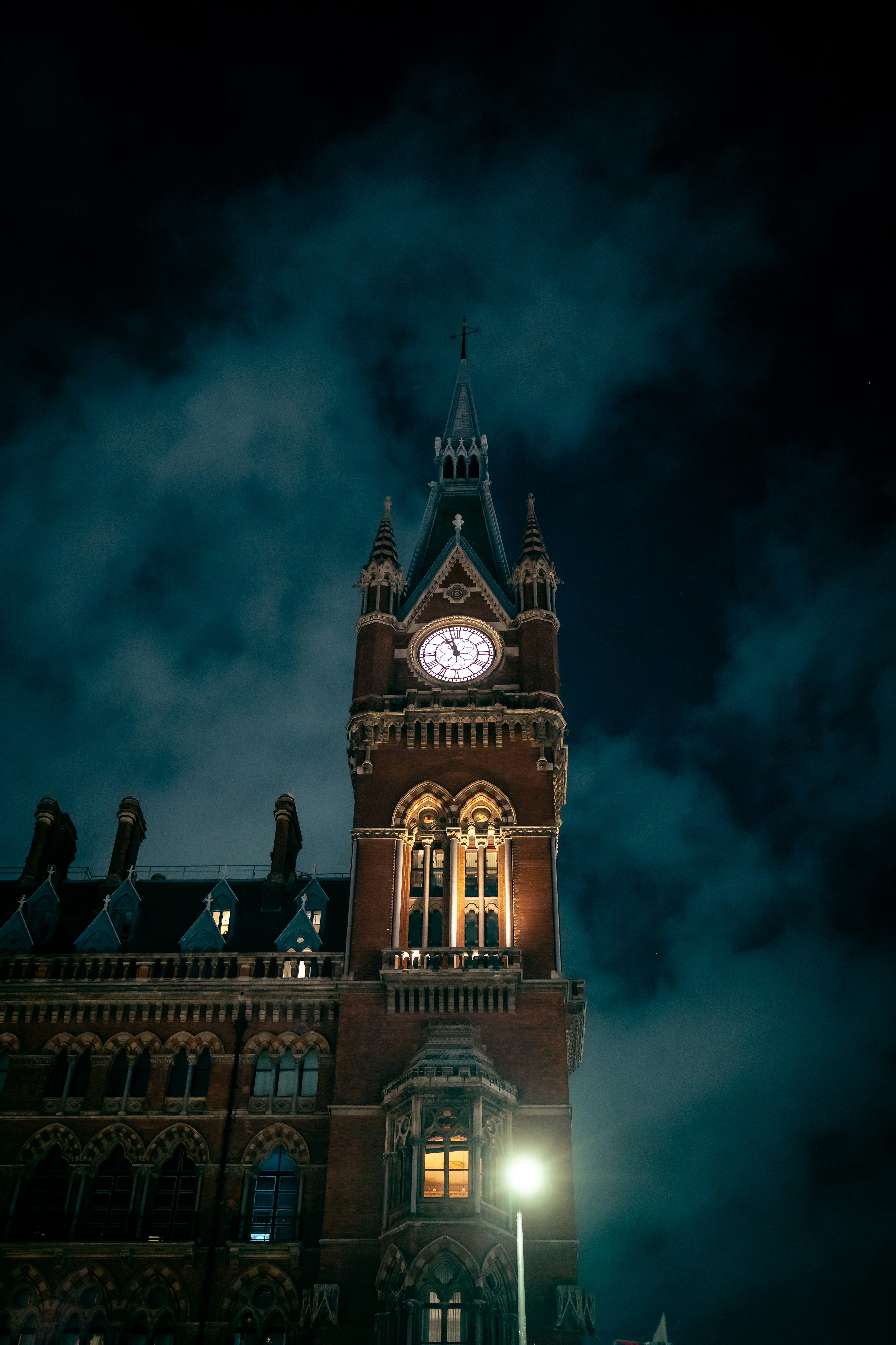 Midnight Clocktower: Ghostly Steam and Light Over the Gothic Spire