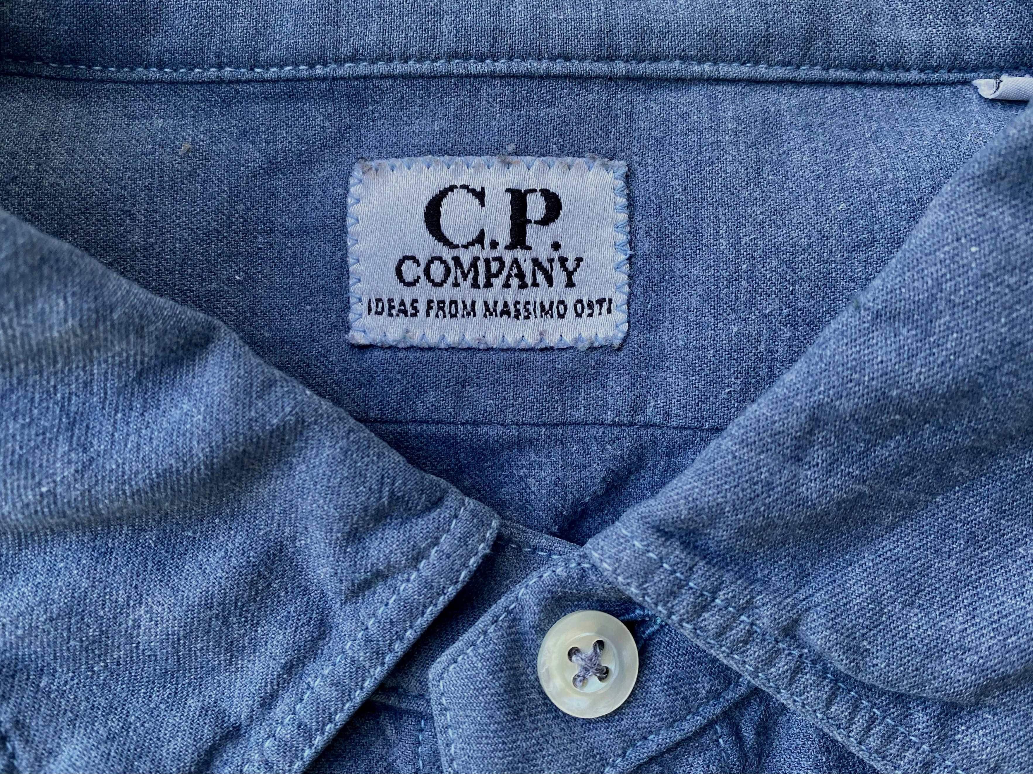 Denim Label Close-Up: The C.P. Company Tag on a Buttoned Collar
