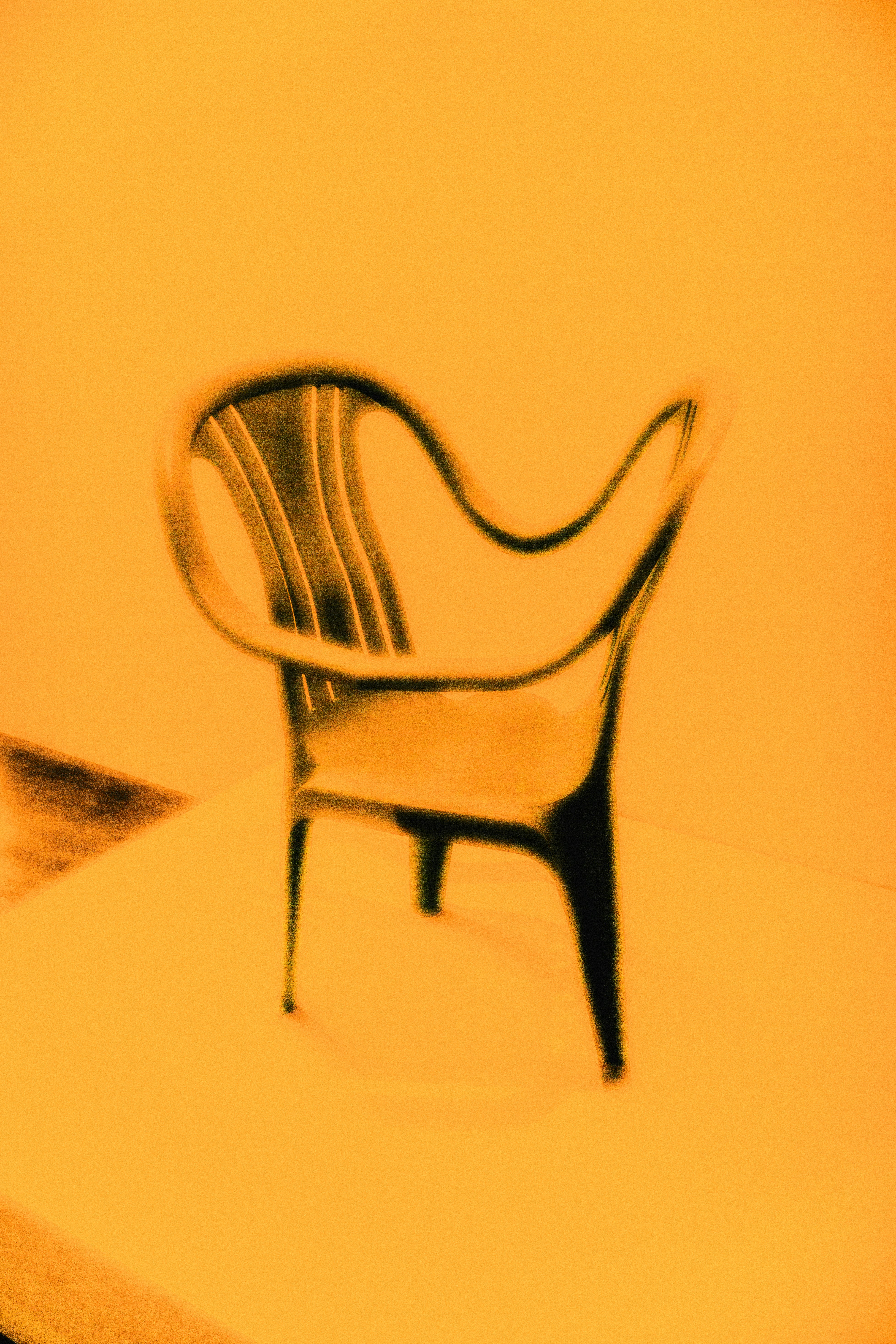 Liquid Shadow: A Single Chair in an Amber Quiet Room