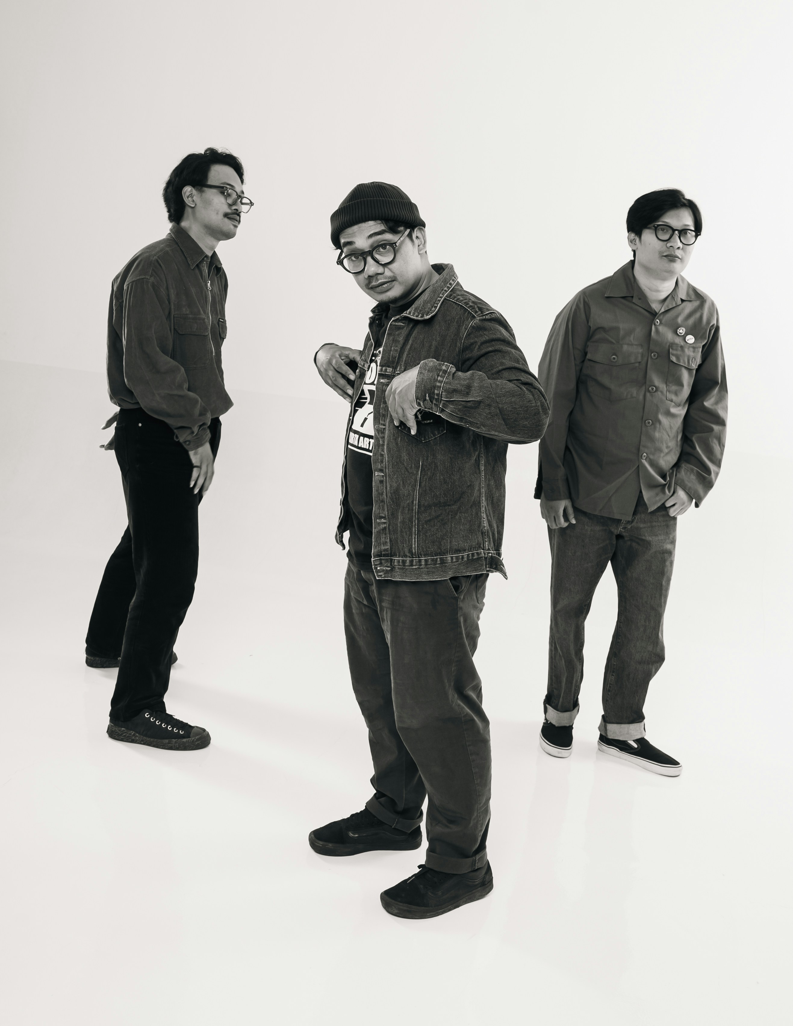 Triad in Mono: A Denim-clad Trio in a Minimal Studio