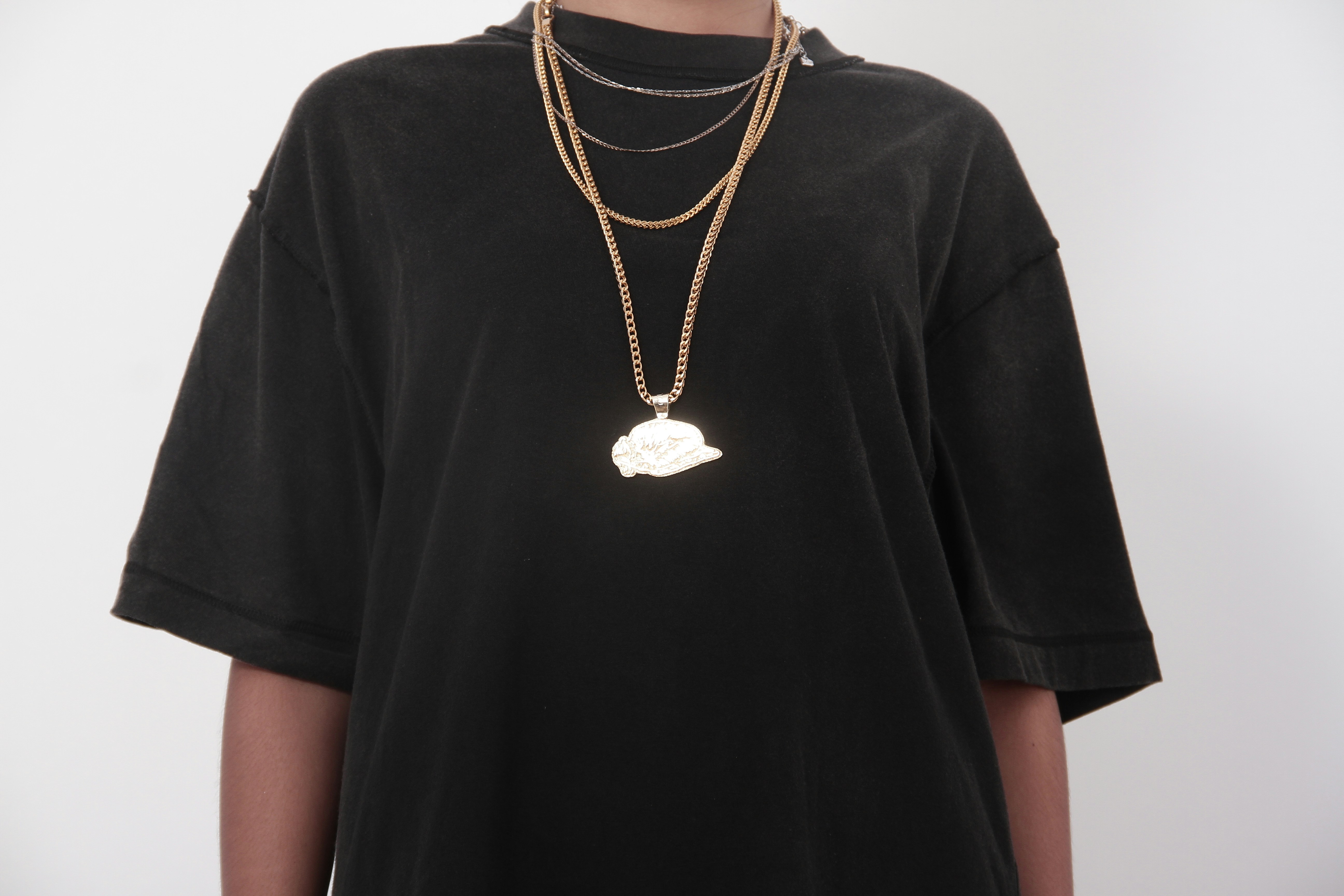 Minimalist Adornment: A Cascade of Chains and a Silver Cloud