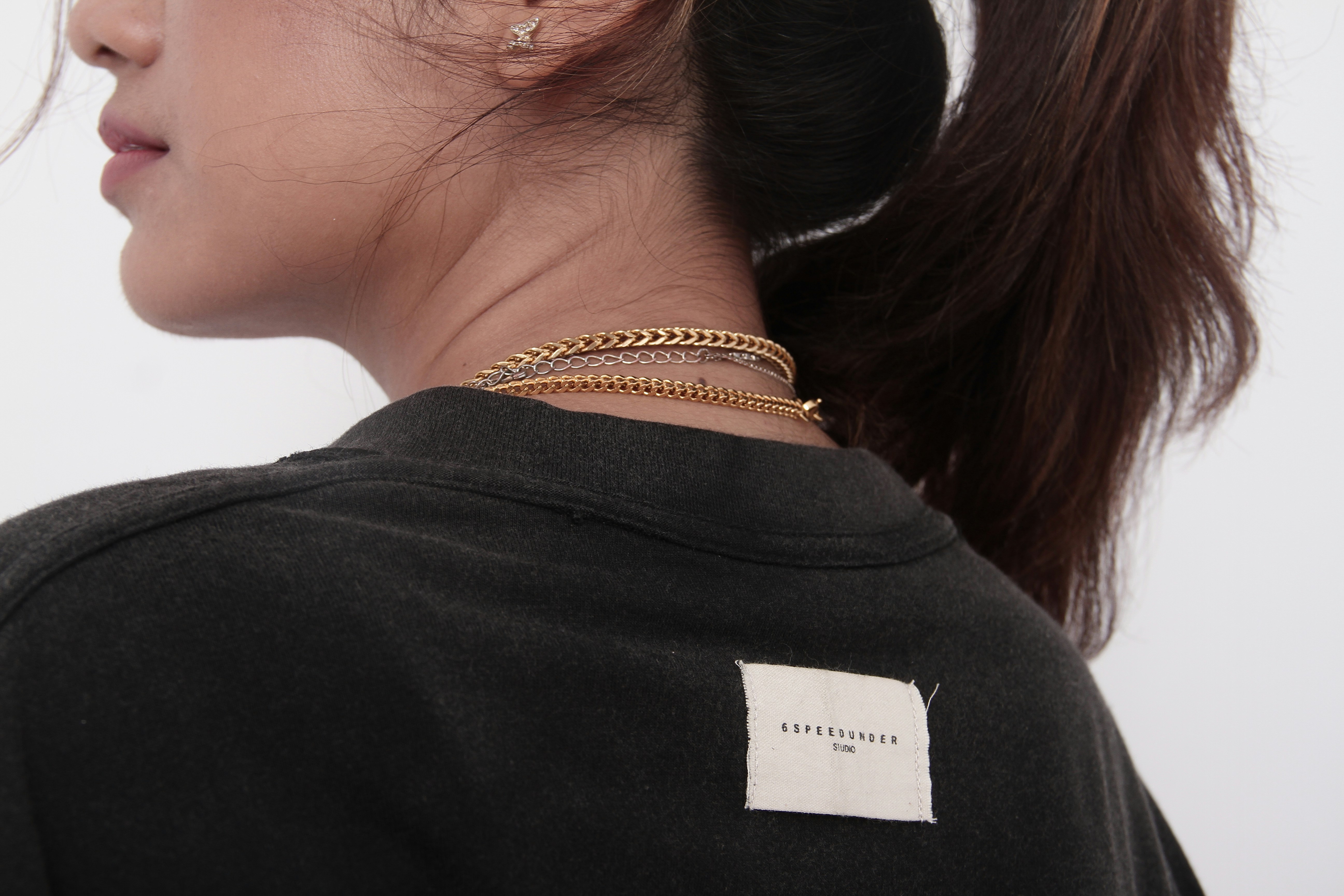 Back View, Gold Chains, and a Subtly Visible Branding Patch