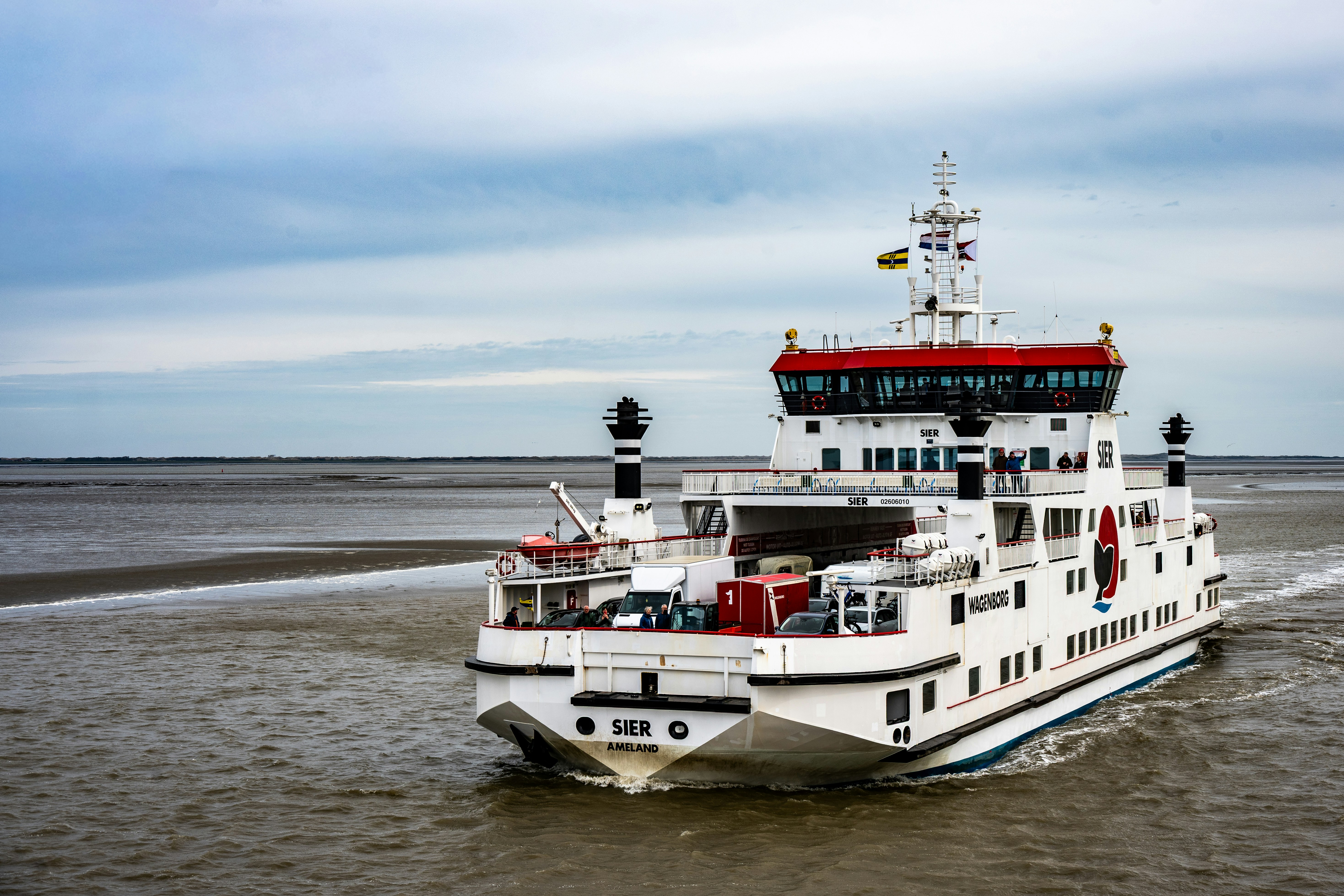 Sea Crossing: The Passenger Ferry Slides Past a Quiet Horizon