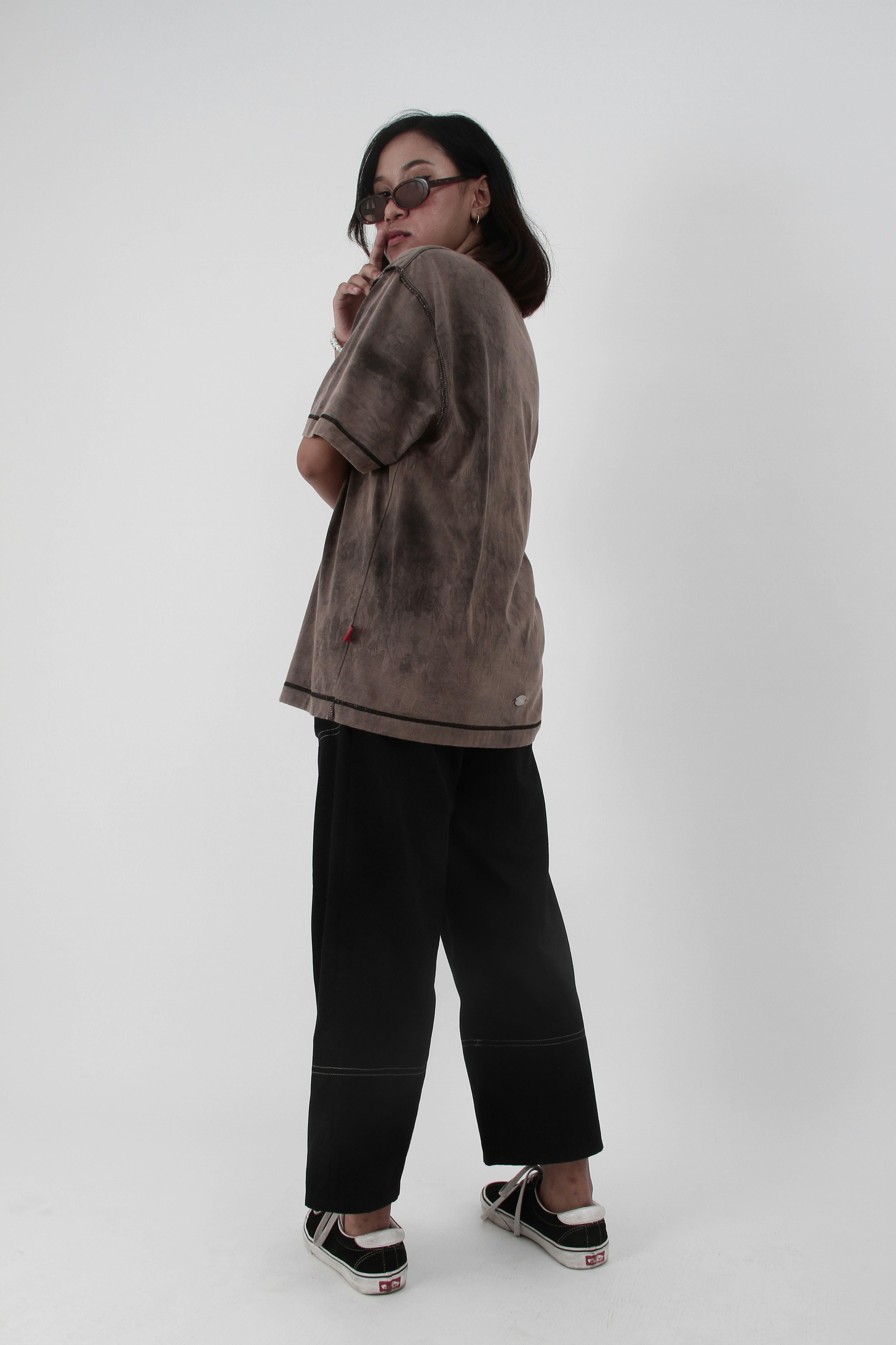Muted Earth Tones and Attitude: A Side Profile in Relaxed Streetwear