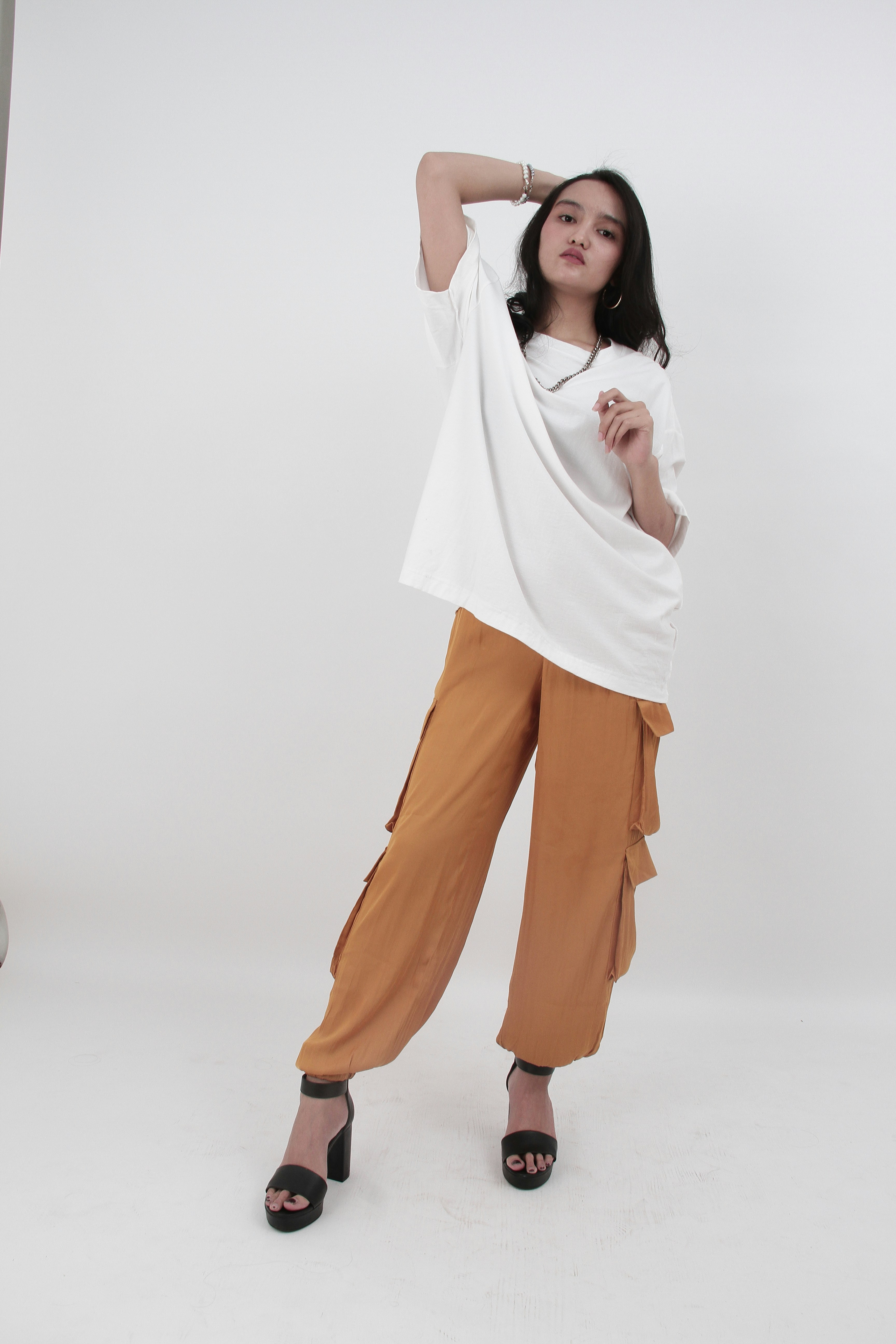 Casual Pose in White T‑Shirt with Mustard Cargo Pants