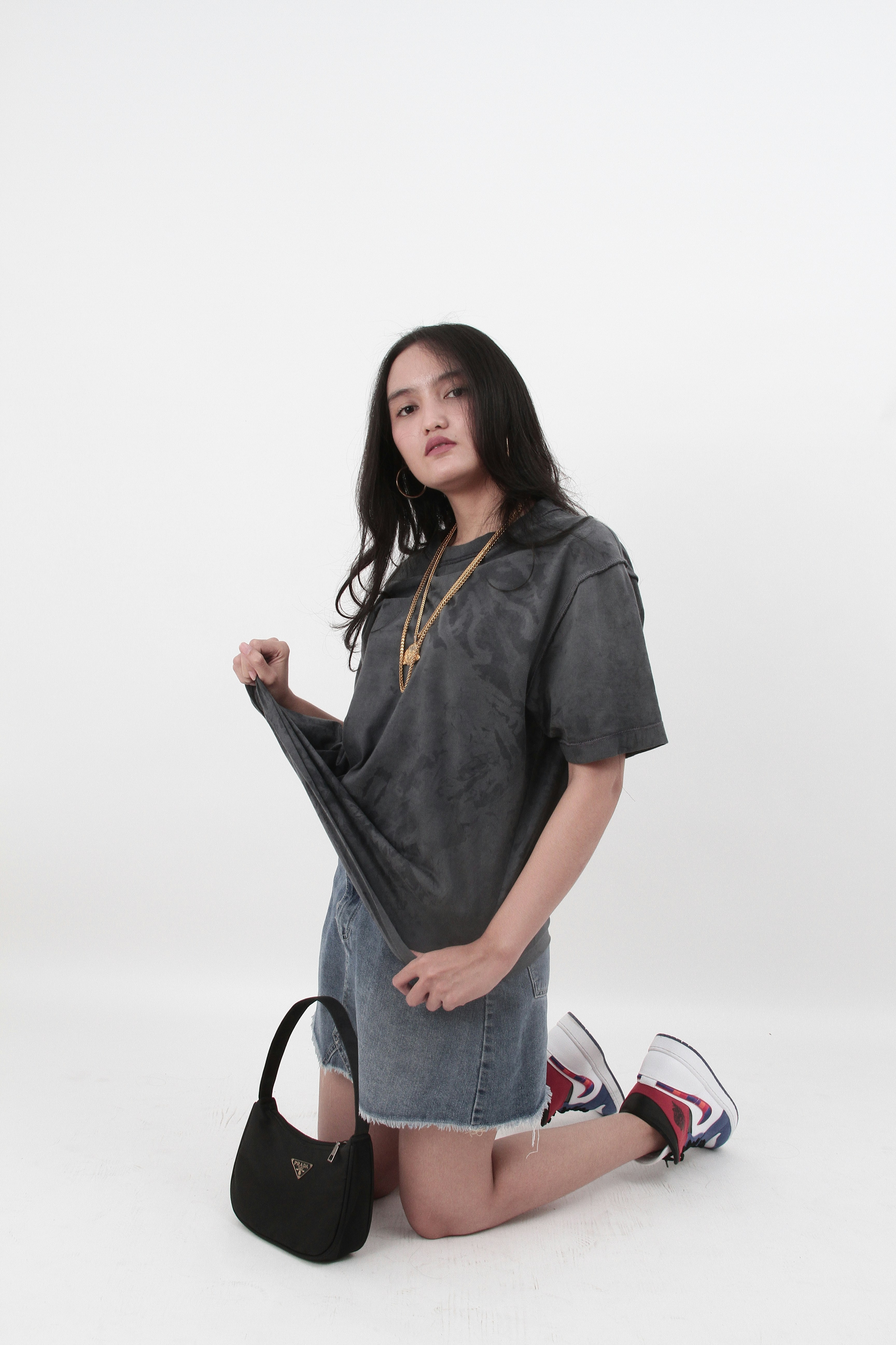 Portrait in a Studio Glow: casual denim and dark tee with sneakers