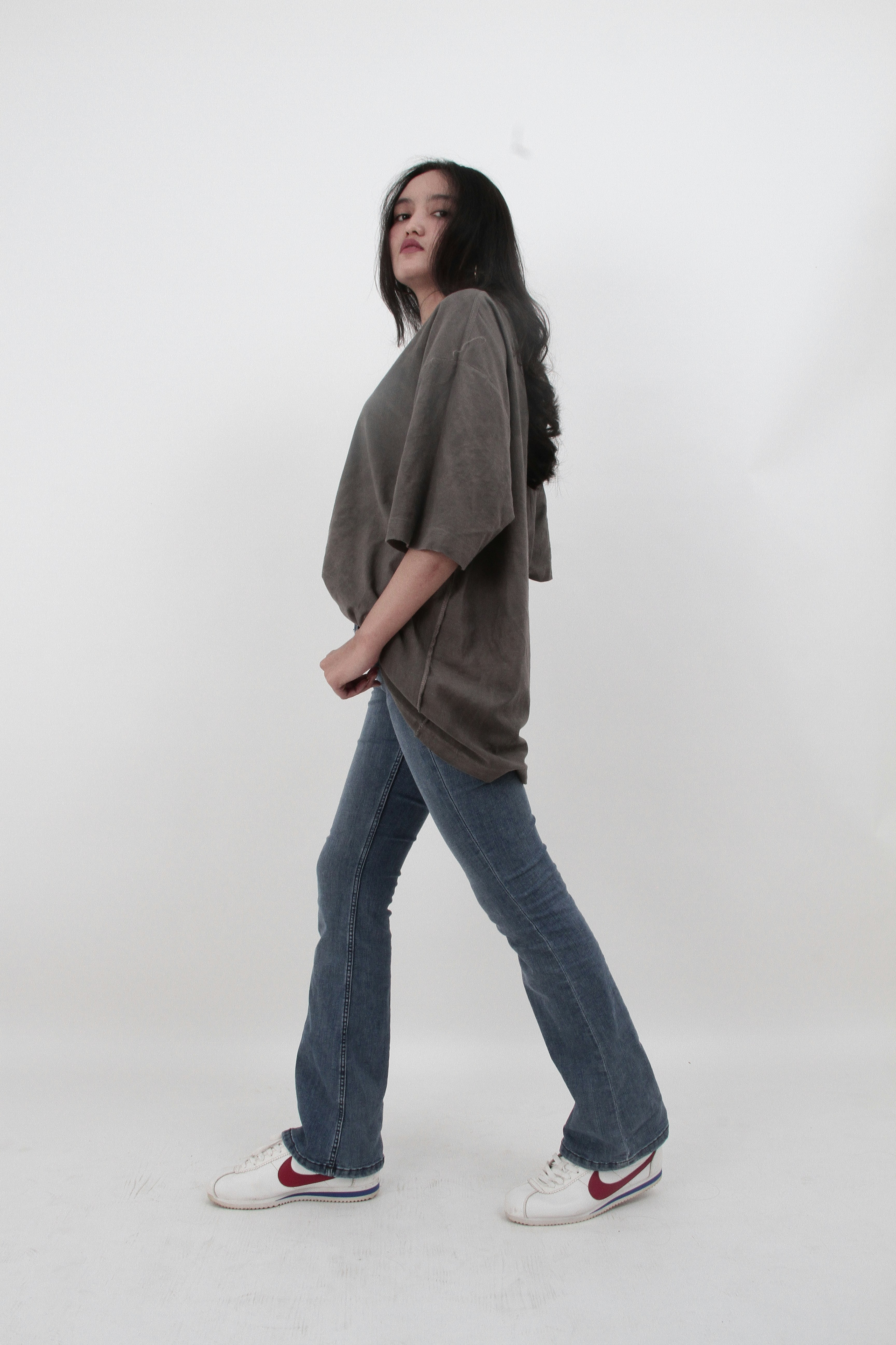 Stride with Confidence: A Casual Pose in Soft Gray