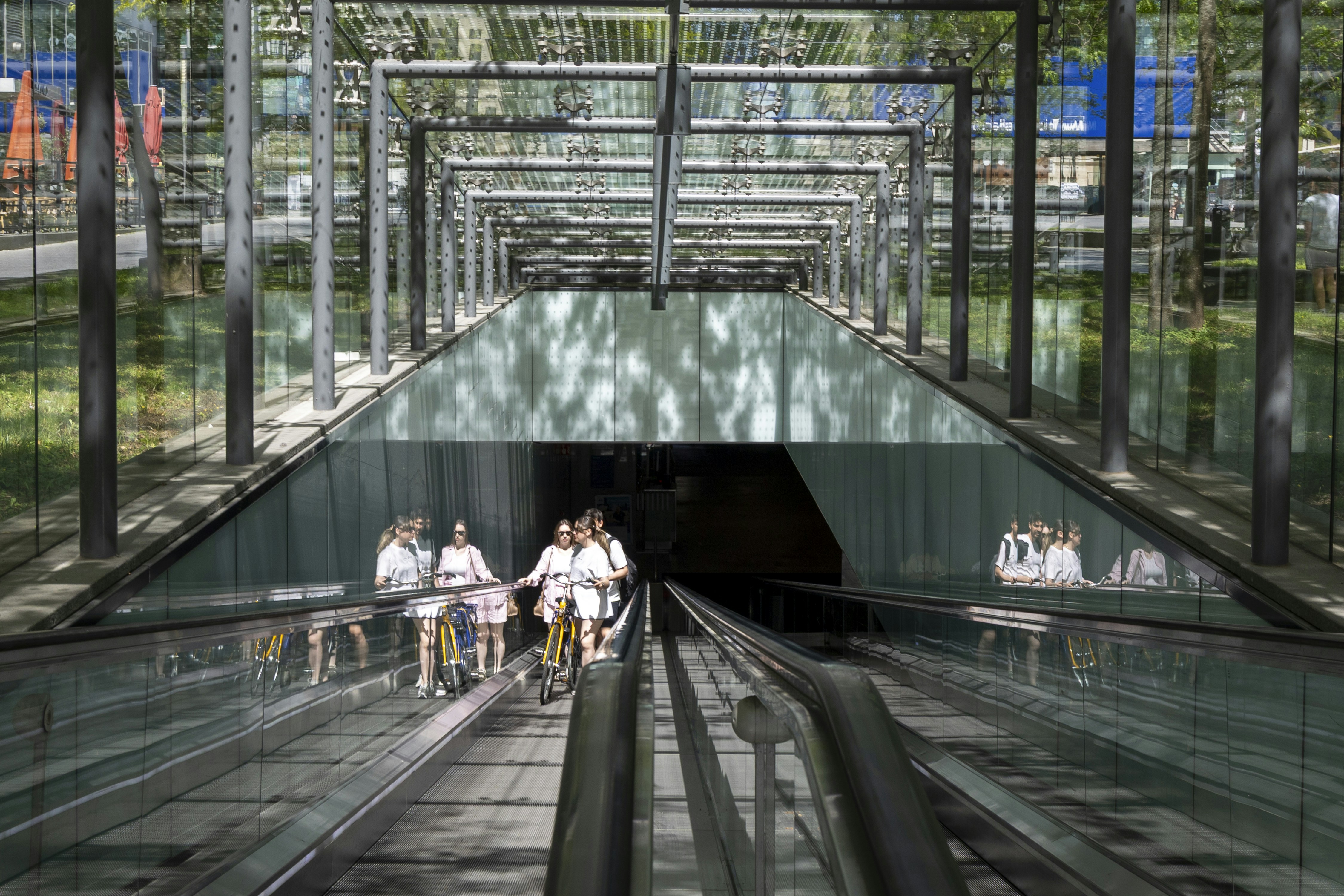 Escalator Chorus Under Glass Canopy