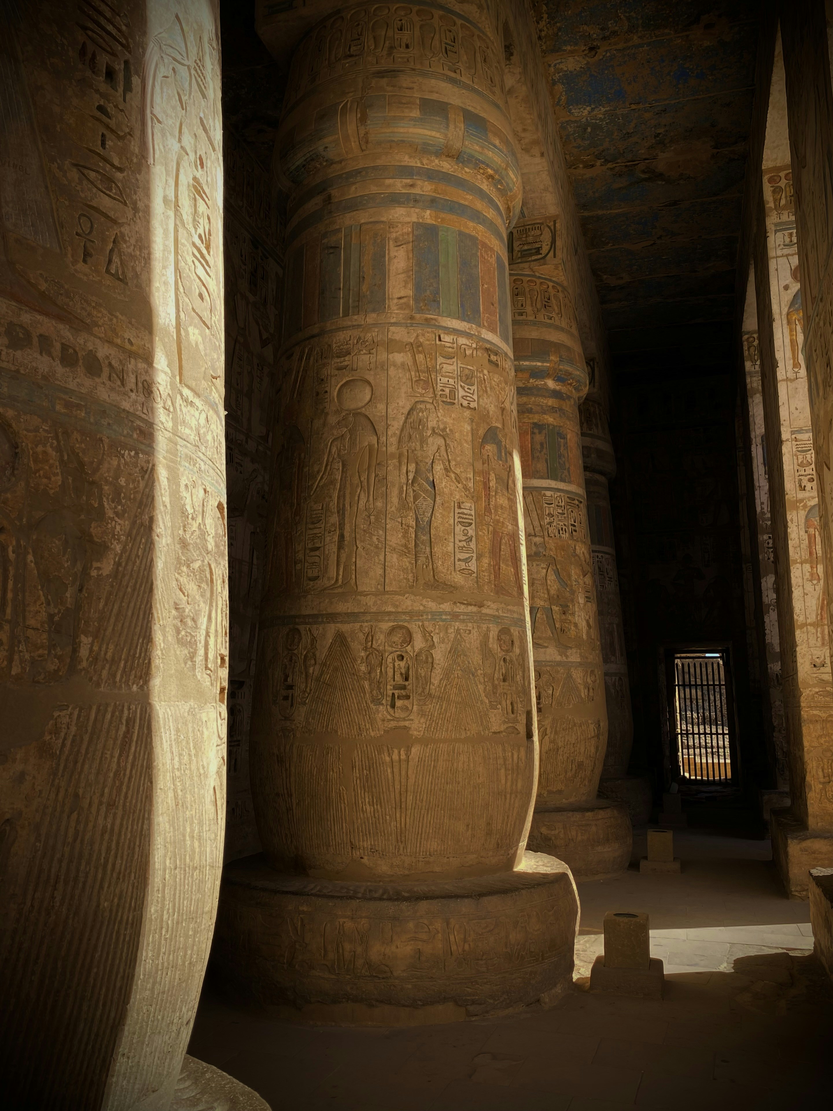 Columns of Ancient Echoes: Hieroglyphs Waiting in the Dim Corridor