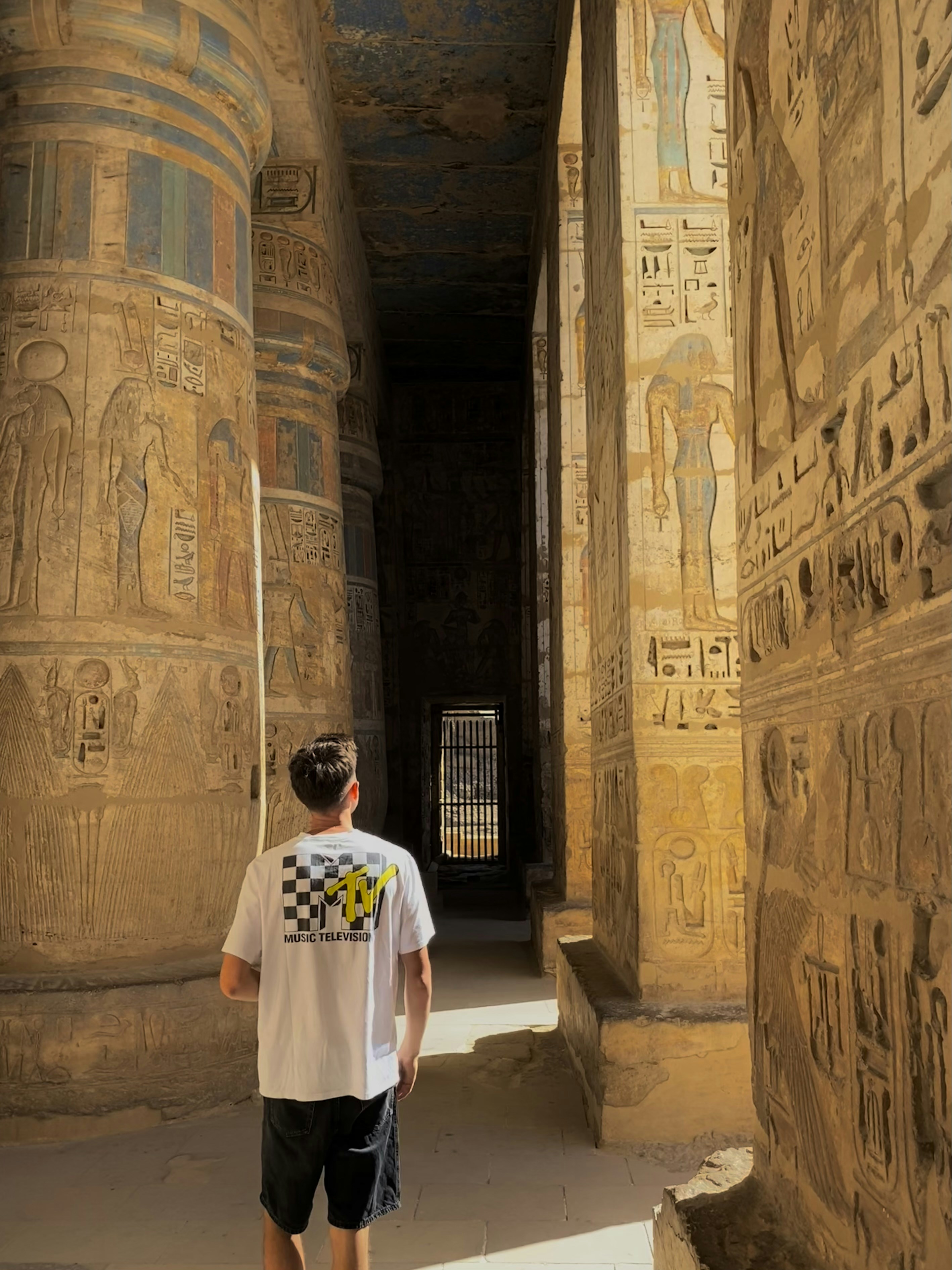 Traveler in an Ancient Corridor of Hieroglyphs