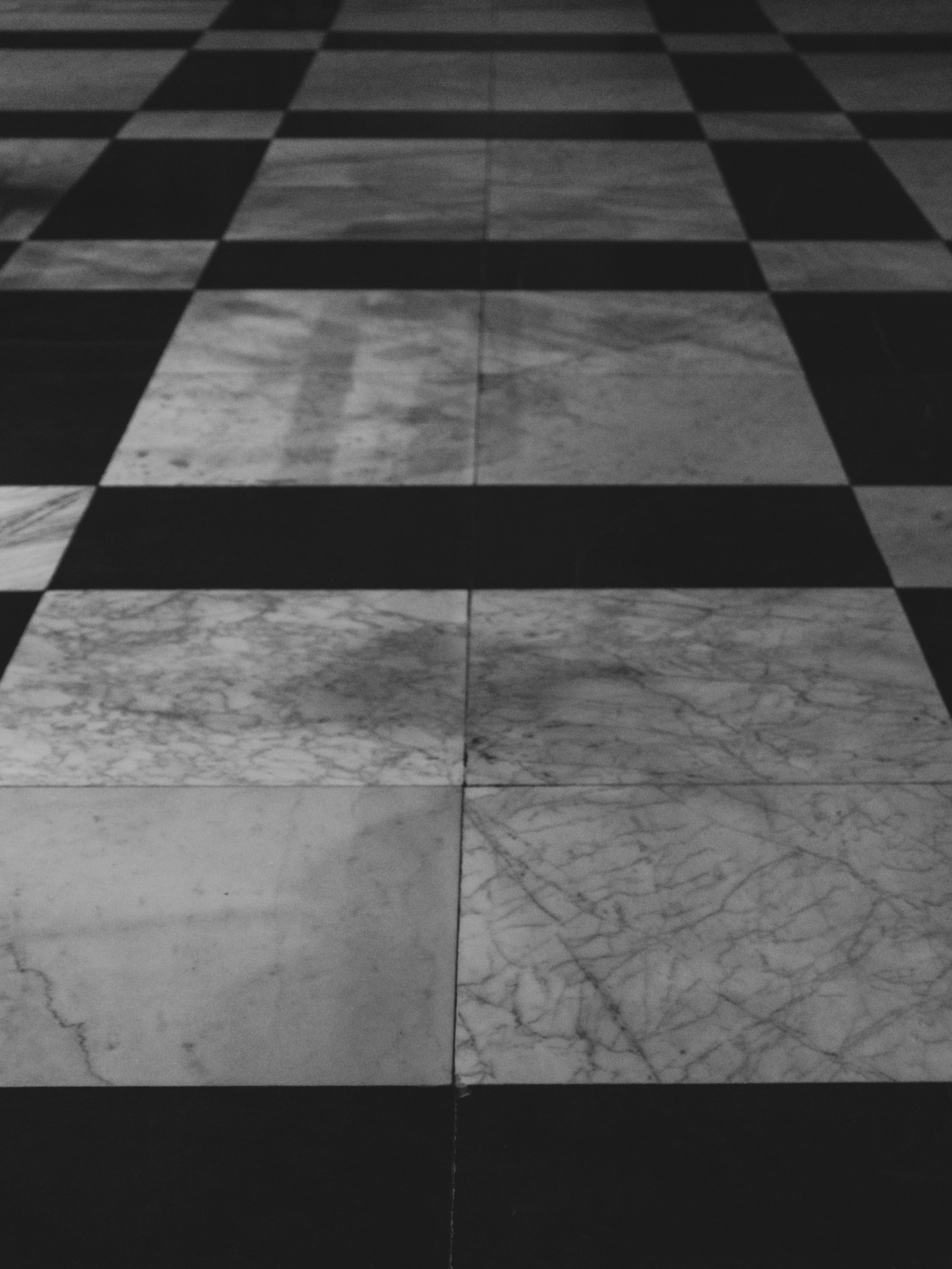 Checkerboard Echoes: Marble and Shadow on a Quiet Floor