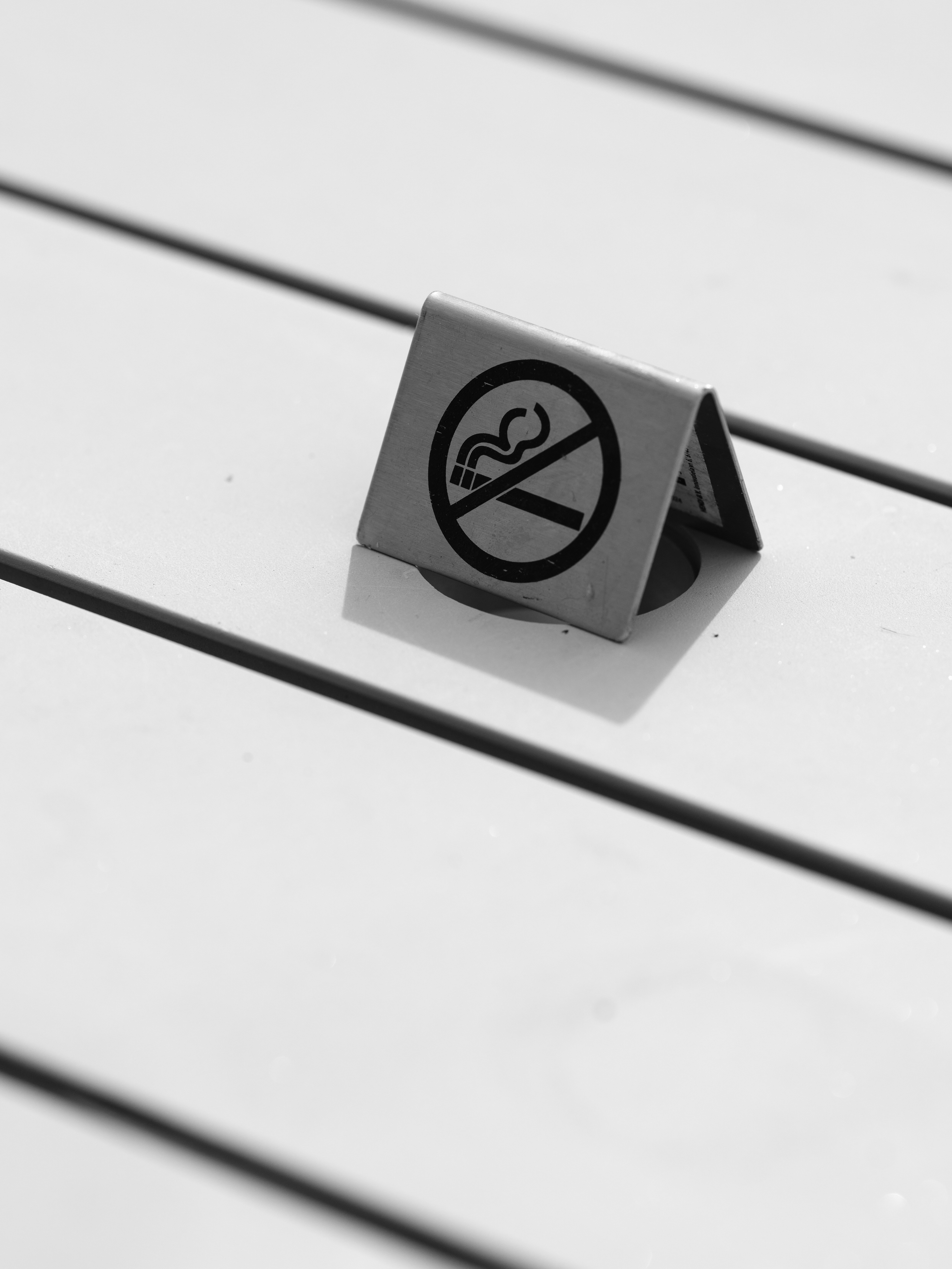 No Smoking Sign on Slatted Surface