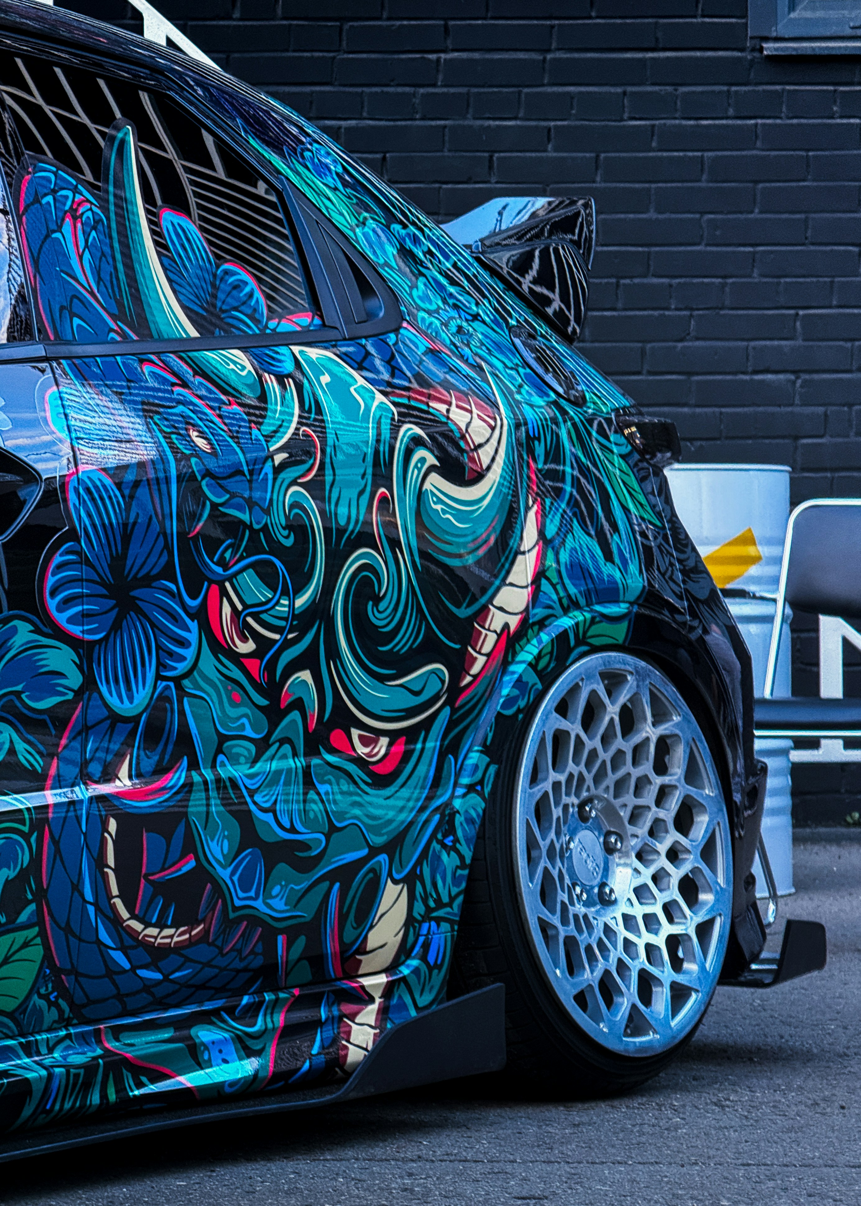 Graffiti-Driven Drift: A Devised Lush Blue Car Portrait