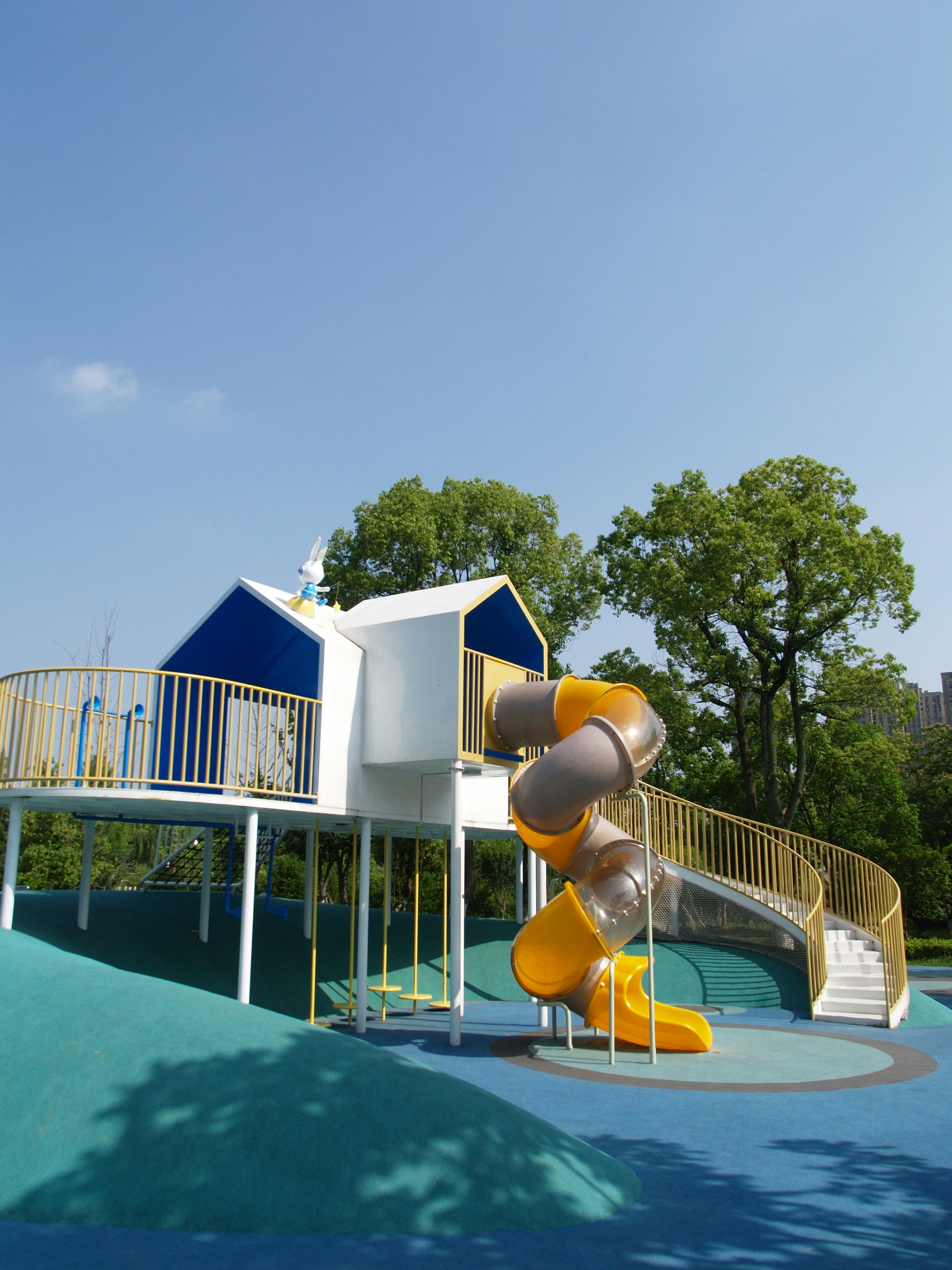 Colorful Playground Fort Rising from a Blue Sky