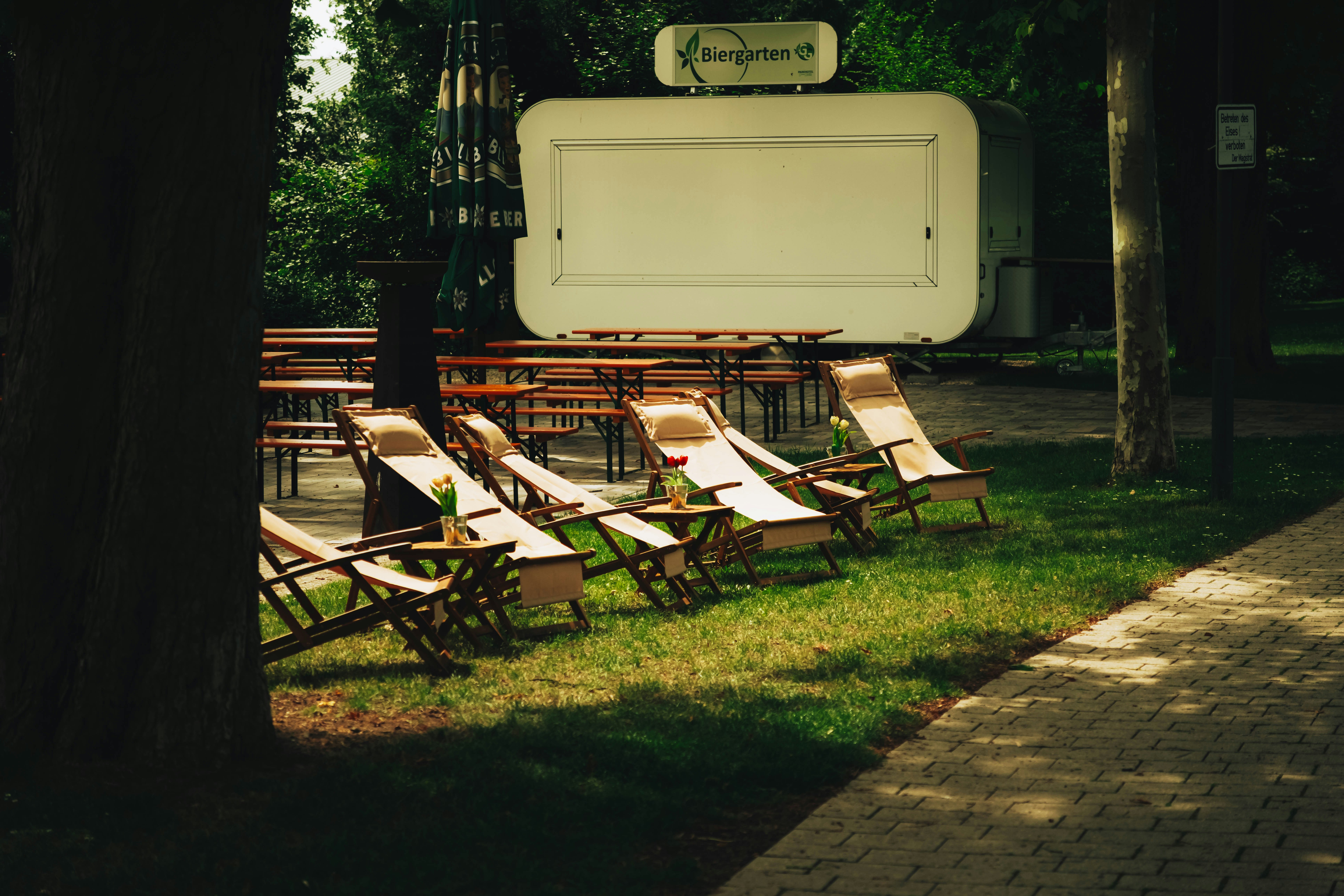 Sunlit Lounge Lineup by the Park Sign