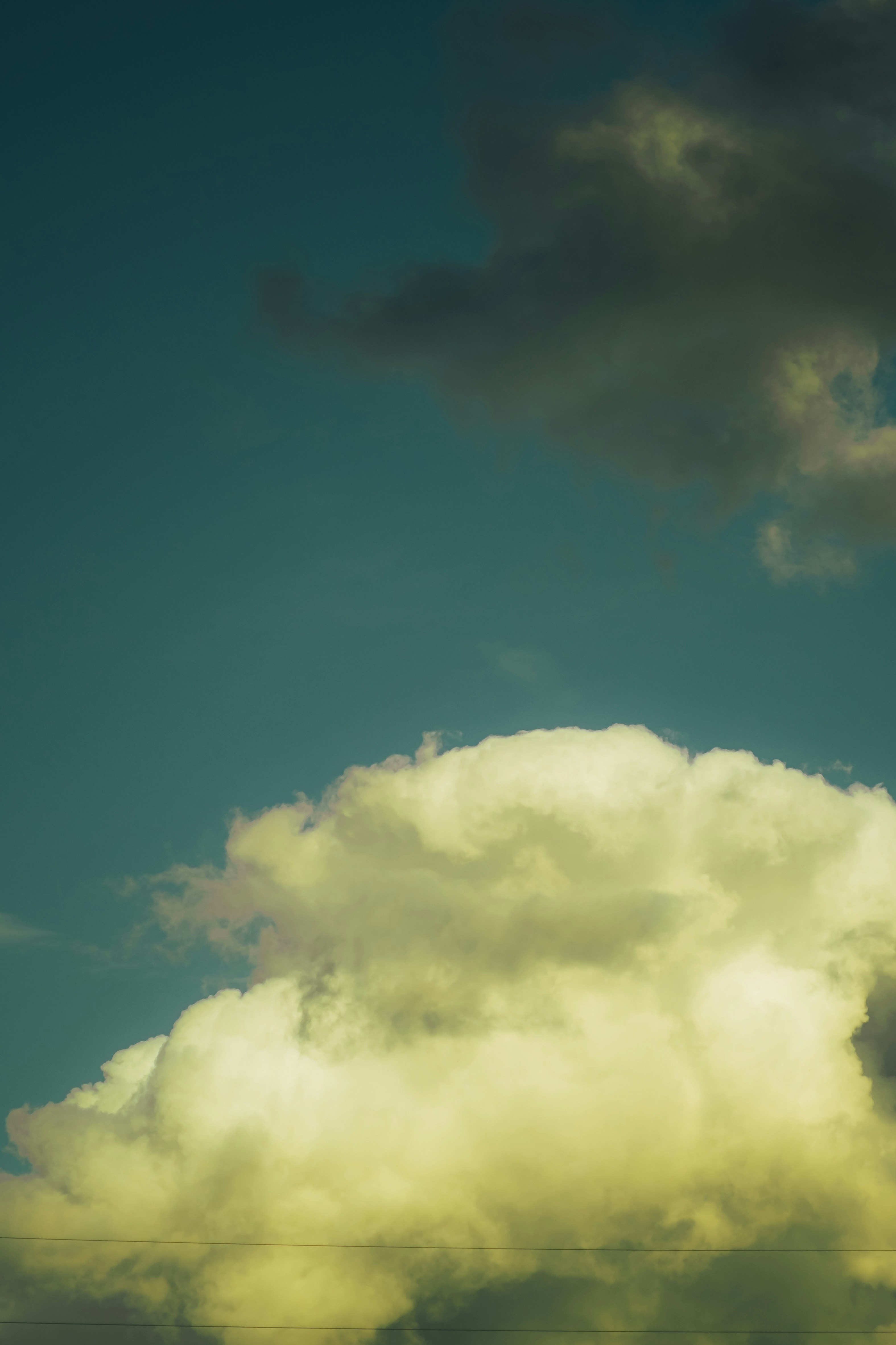 Golden Cloud Above a Calm Horizon