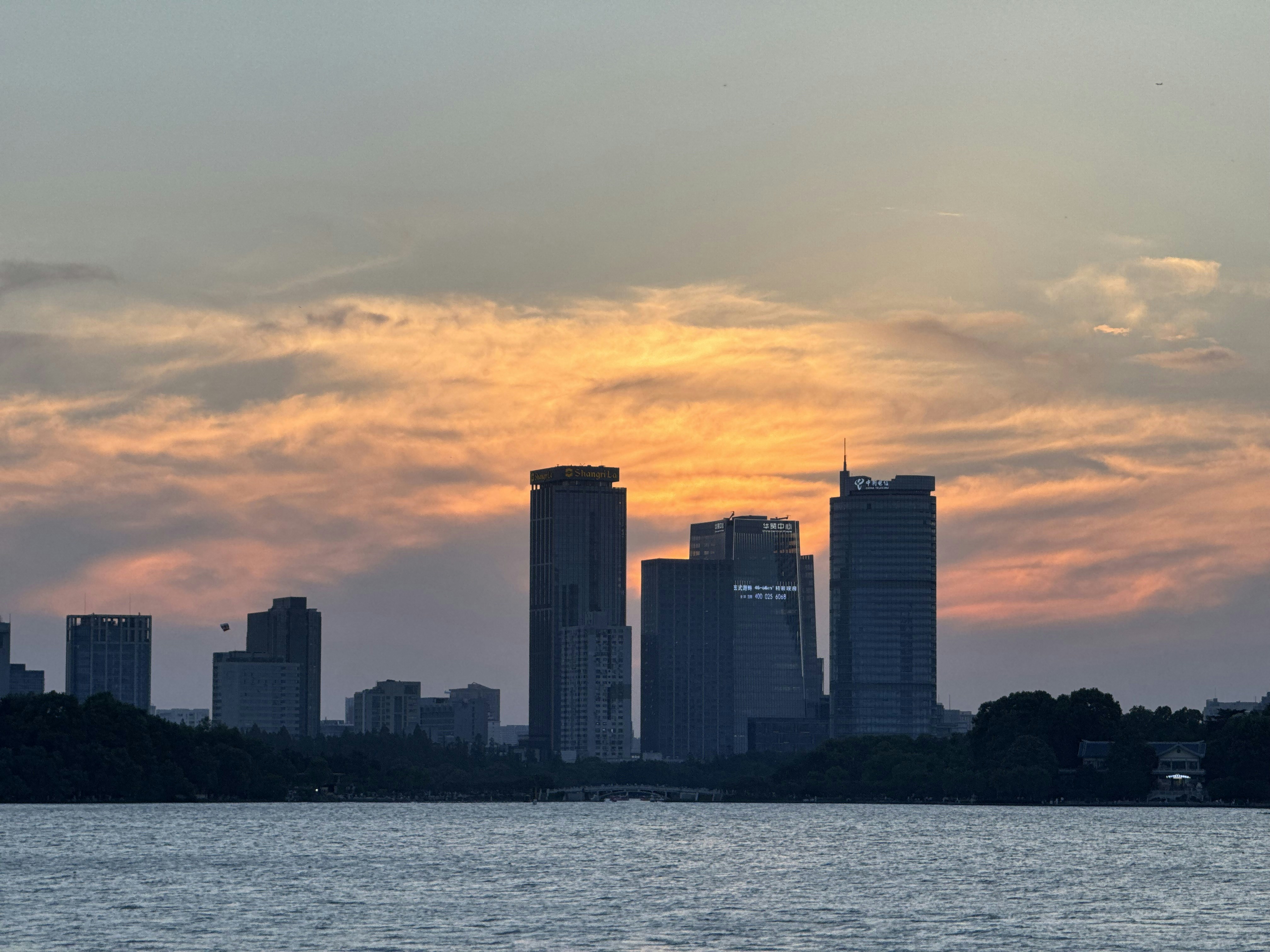 Sunset over a Silhouette: Cityscape on the Quiet Waterfront