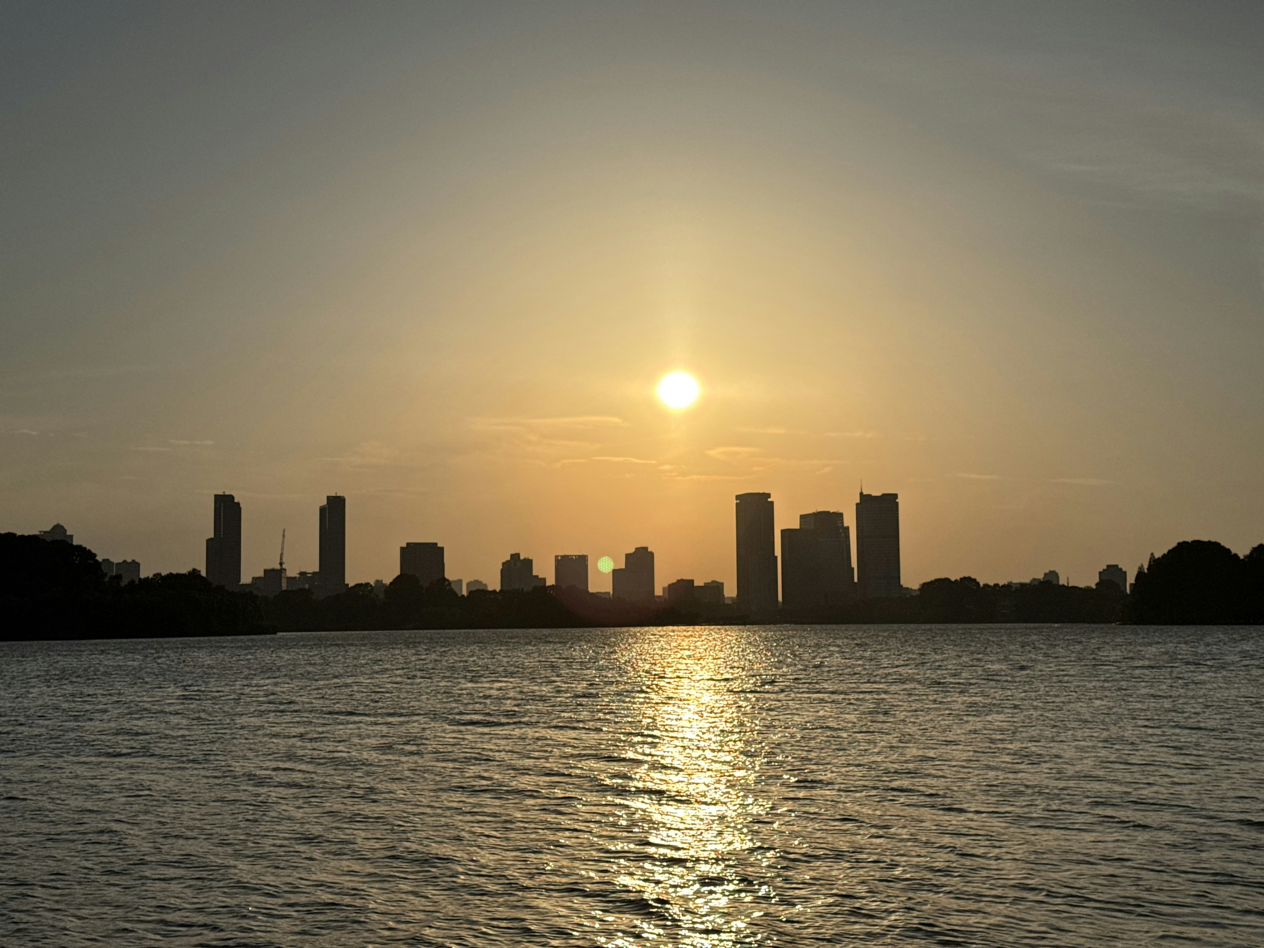Sunlit Horizon: City Silhouette at Dusk