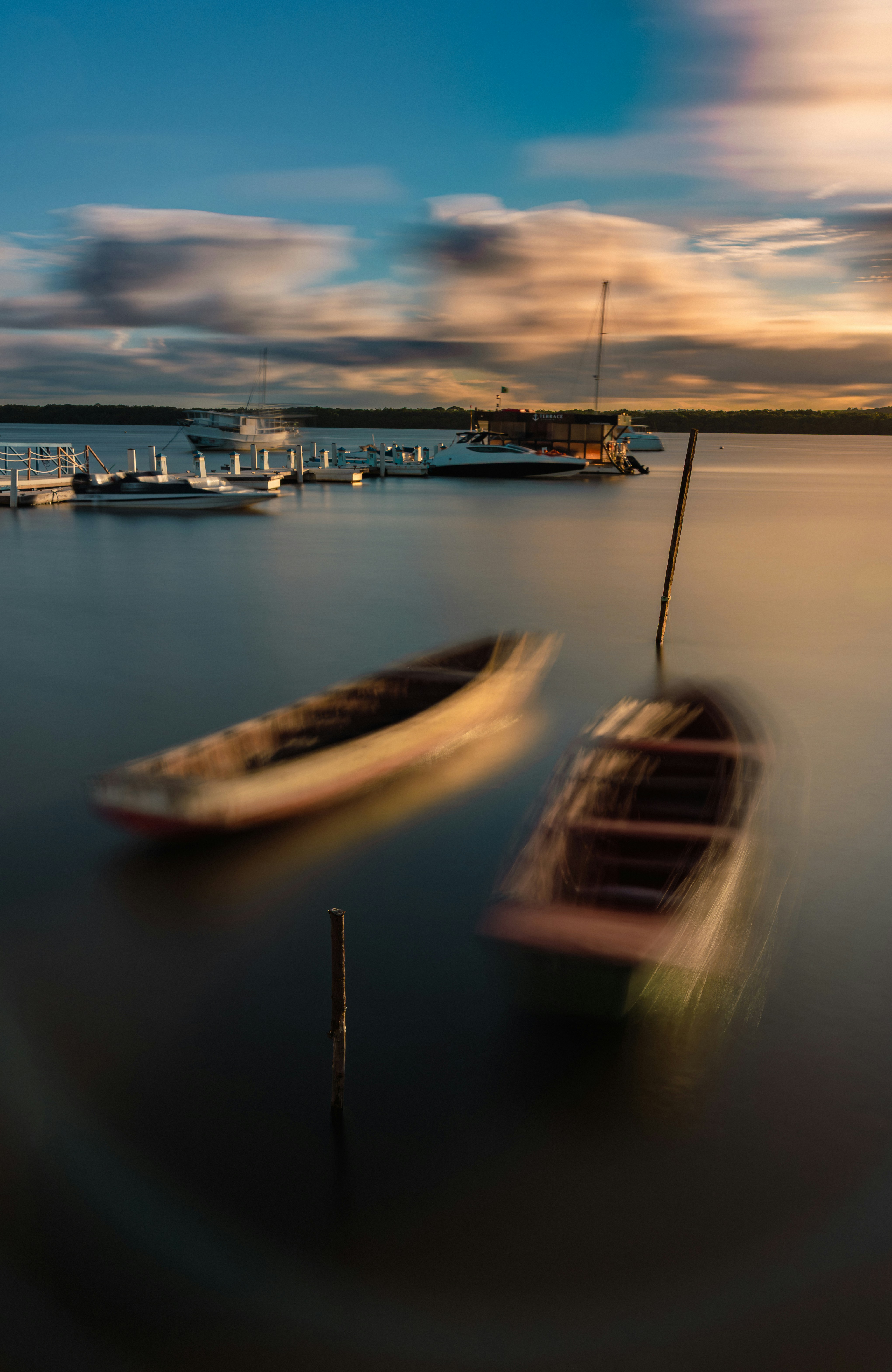 Into the Blur: Boats Rest at Dusk