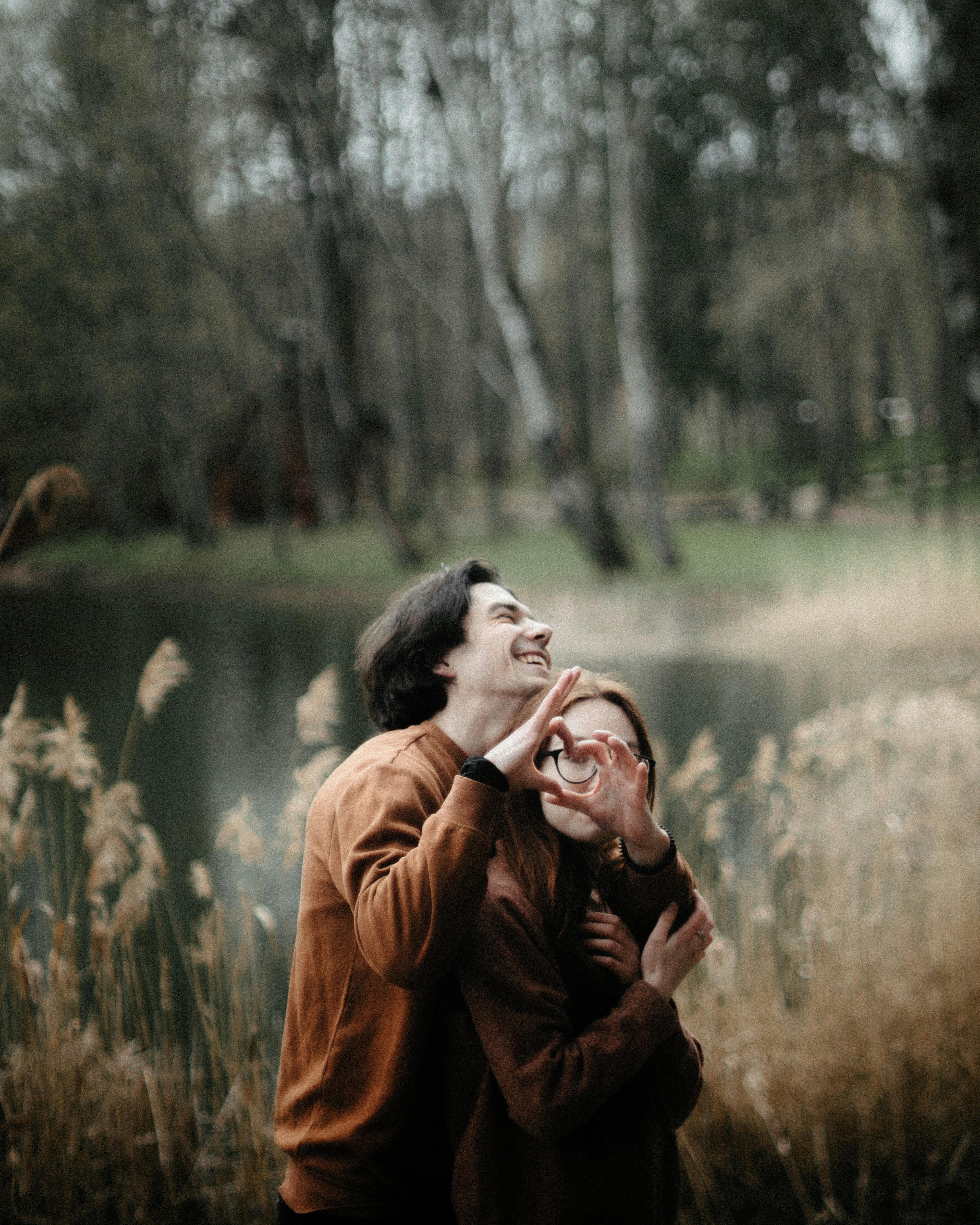Soft embrace by the lakeside: laughter and connection