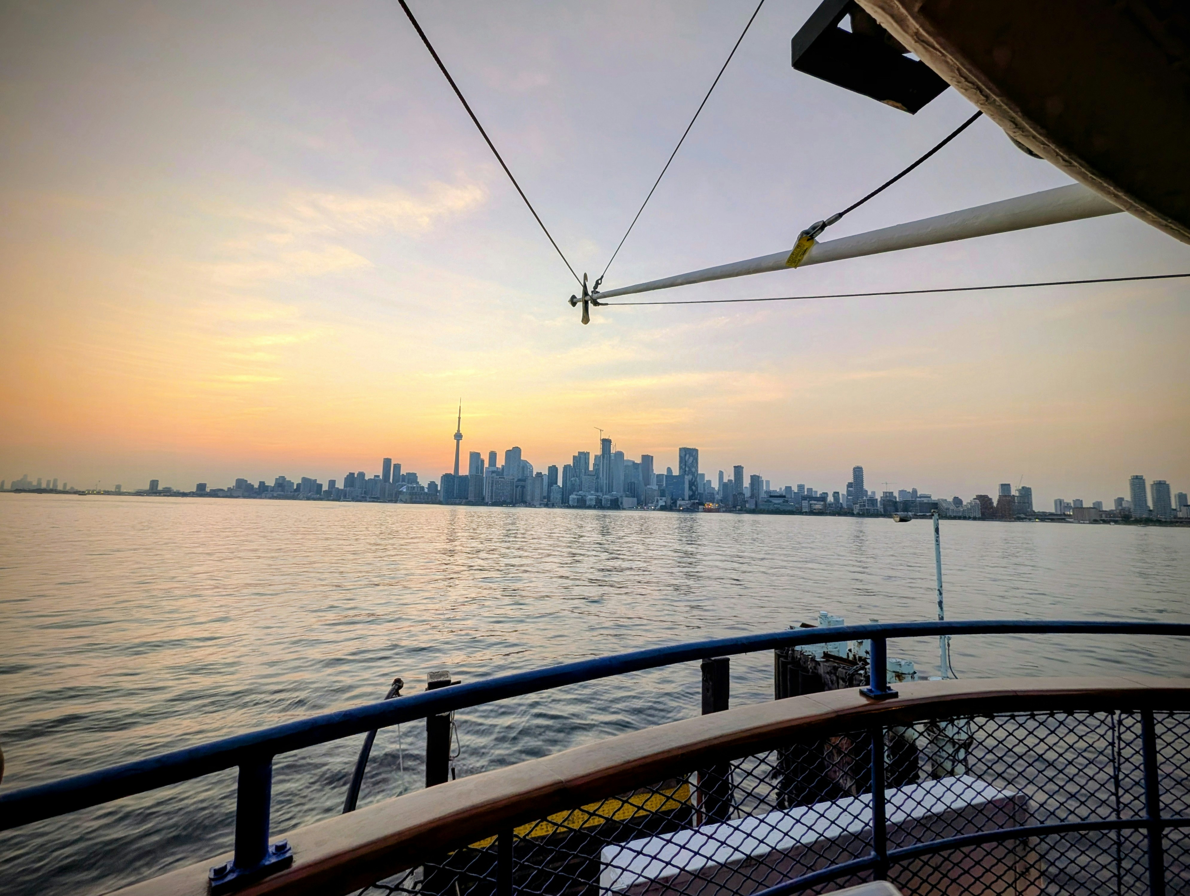 Toronto skyline from a boat at sunset.