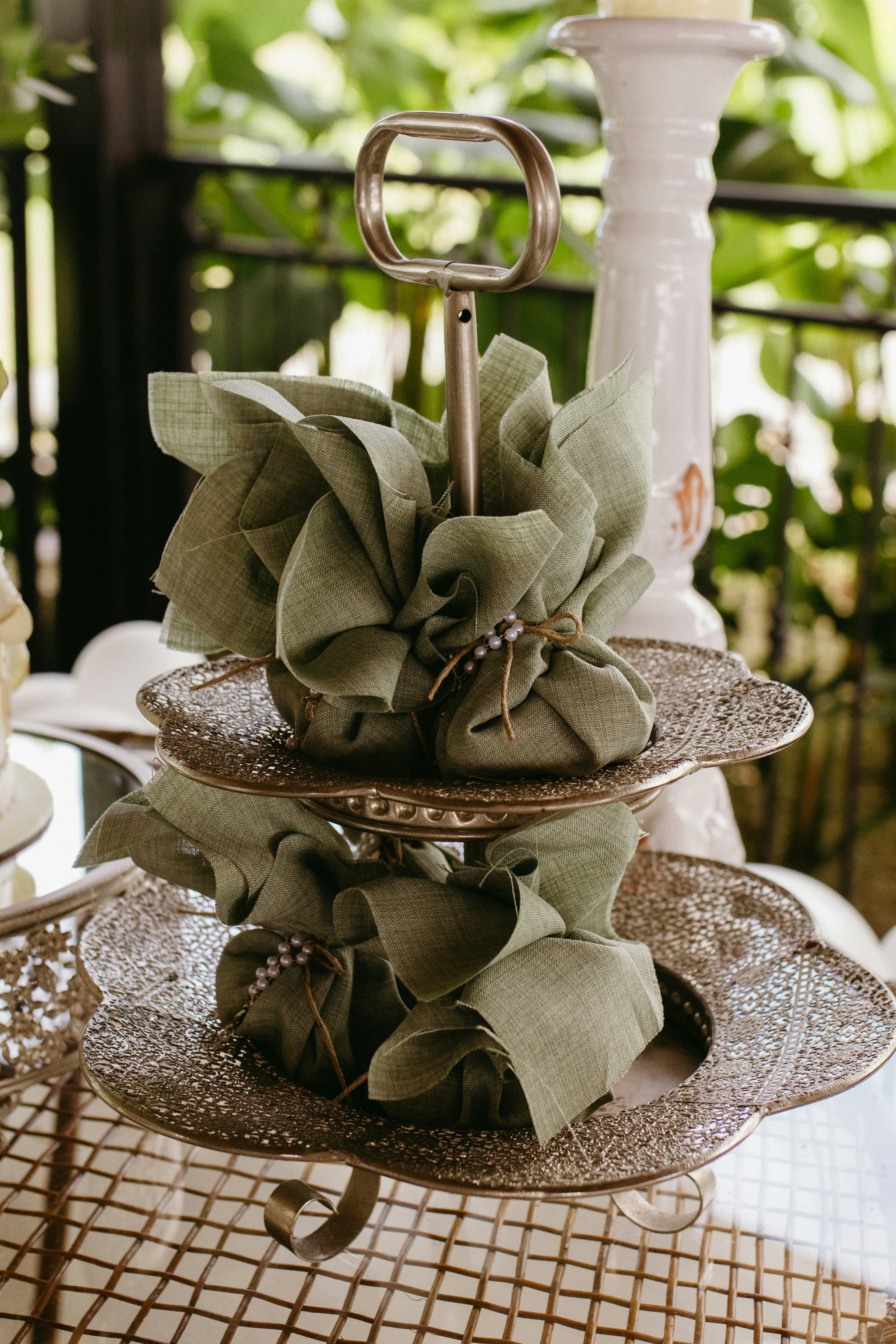 Layered Green Ribbon Crown on a Vintage Stand