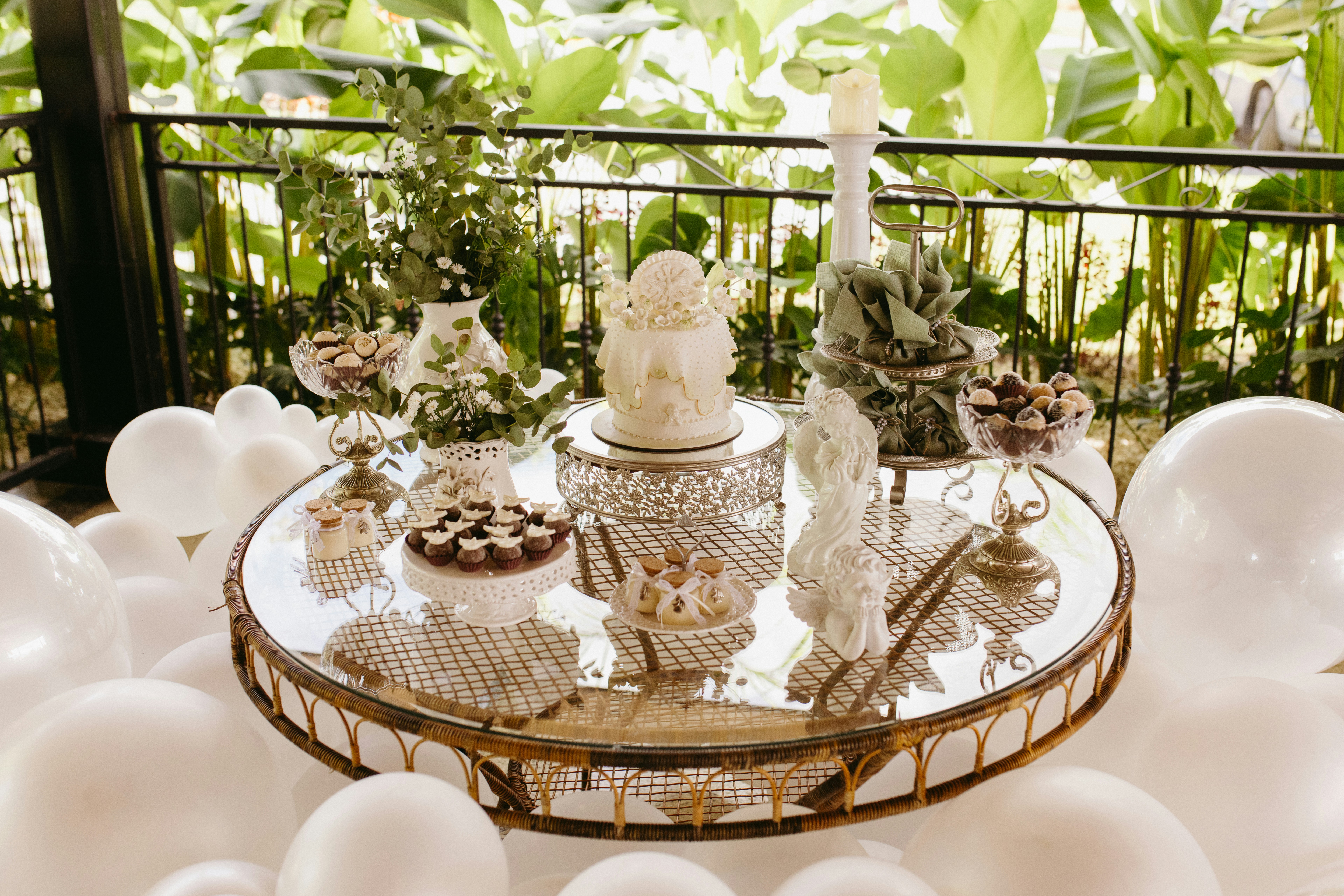An Elegant Tabletop Moment: Candy, Cakes, and Candles on a Mirrored Terrace