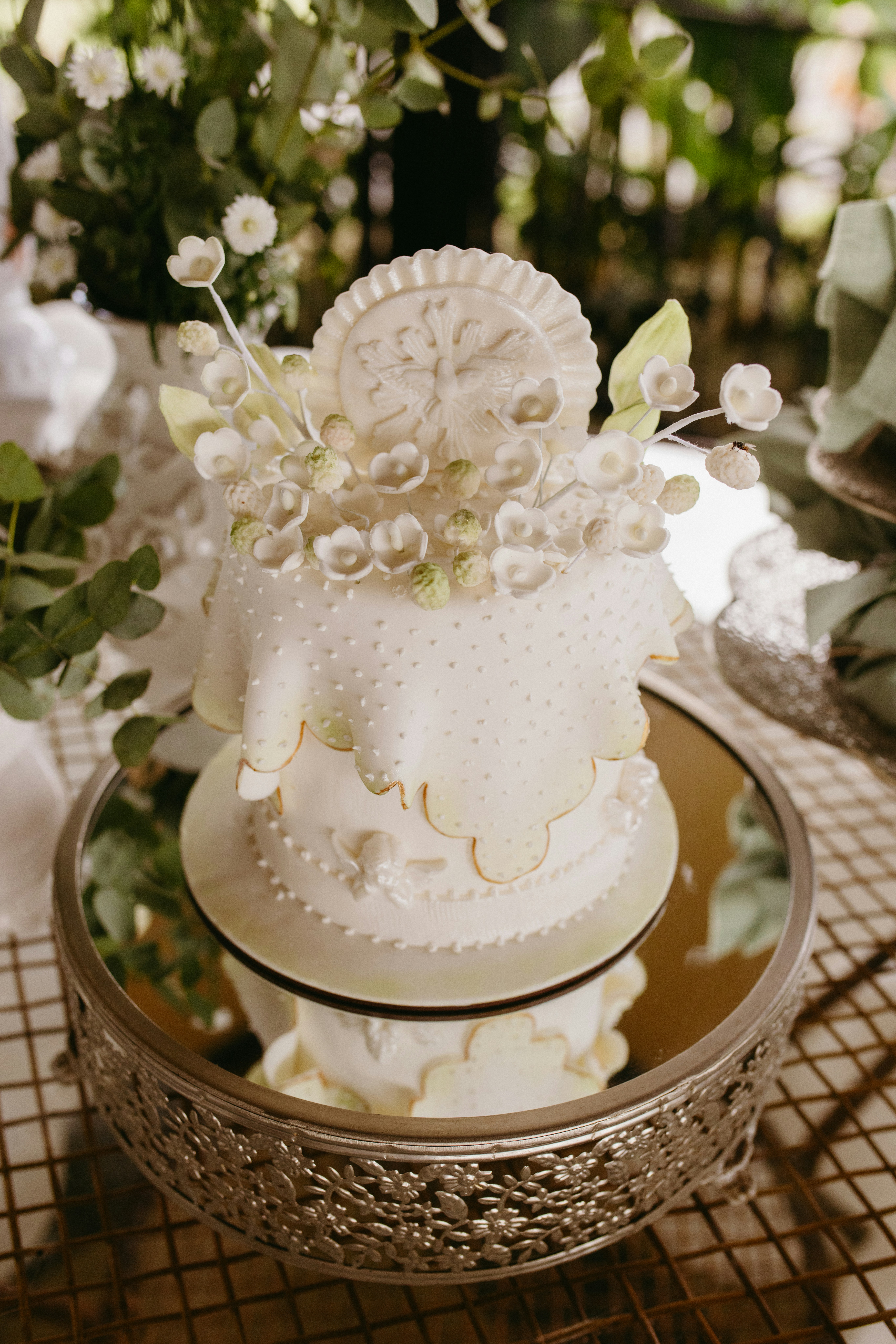 Ivory Cakescape: A Delicate Tiered Bride-and-Bloom centerpiece