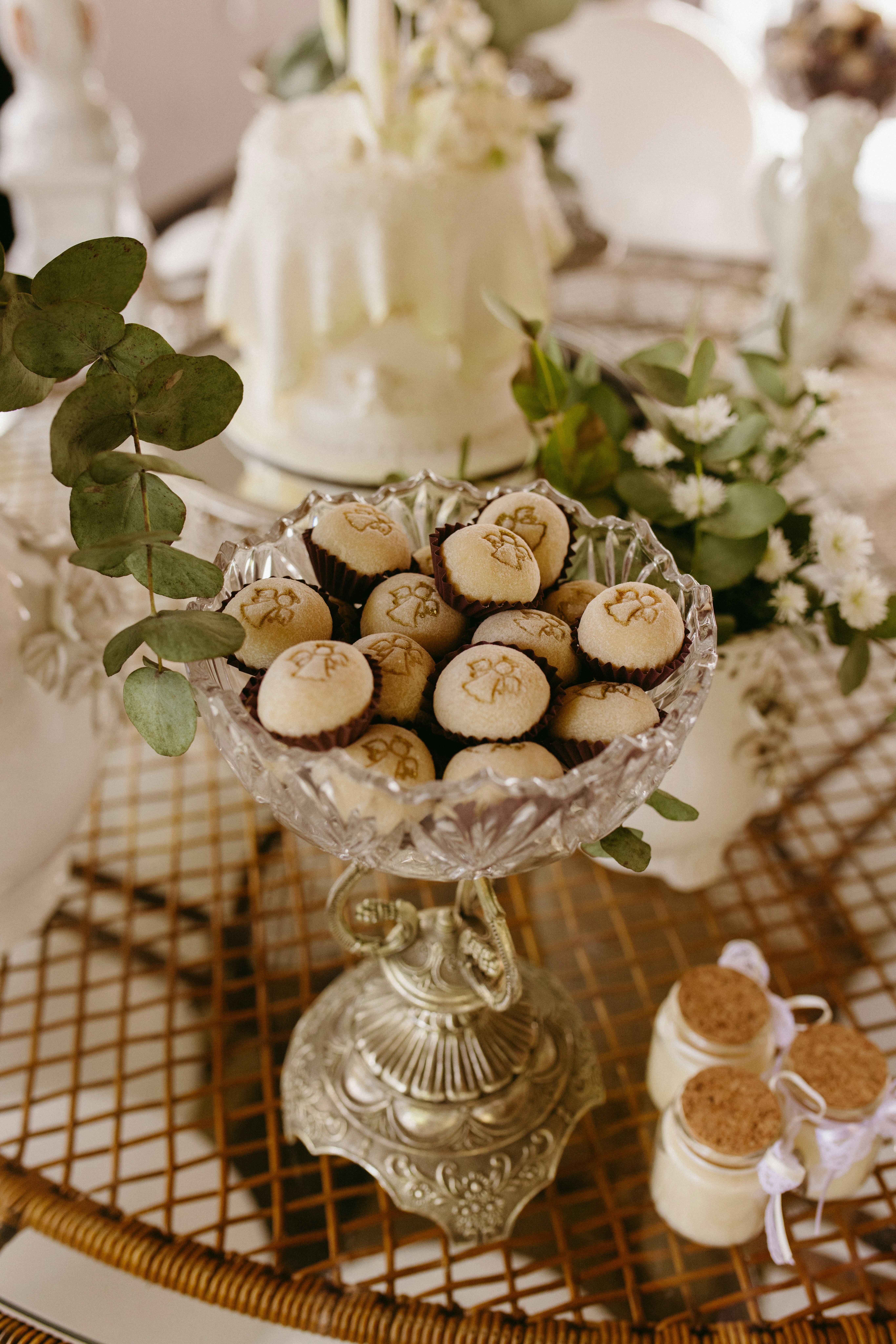 Silvery pedestal of bite-sized elegance: minted cupcakes on a vintage dessert stand