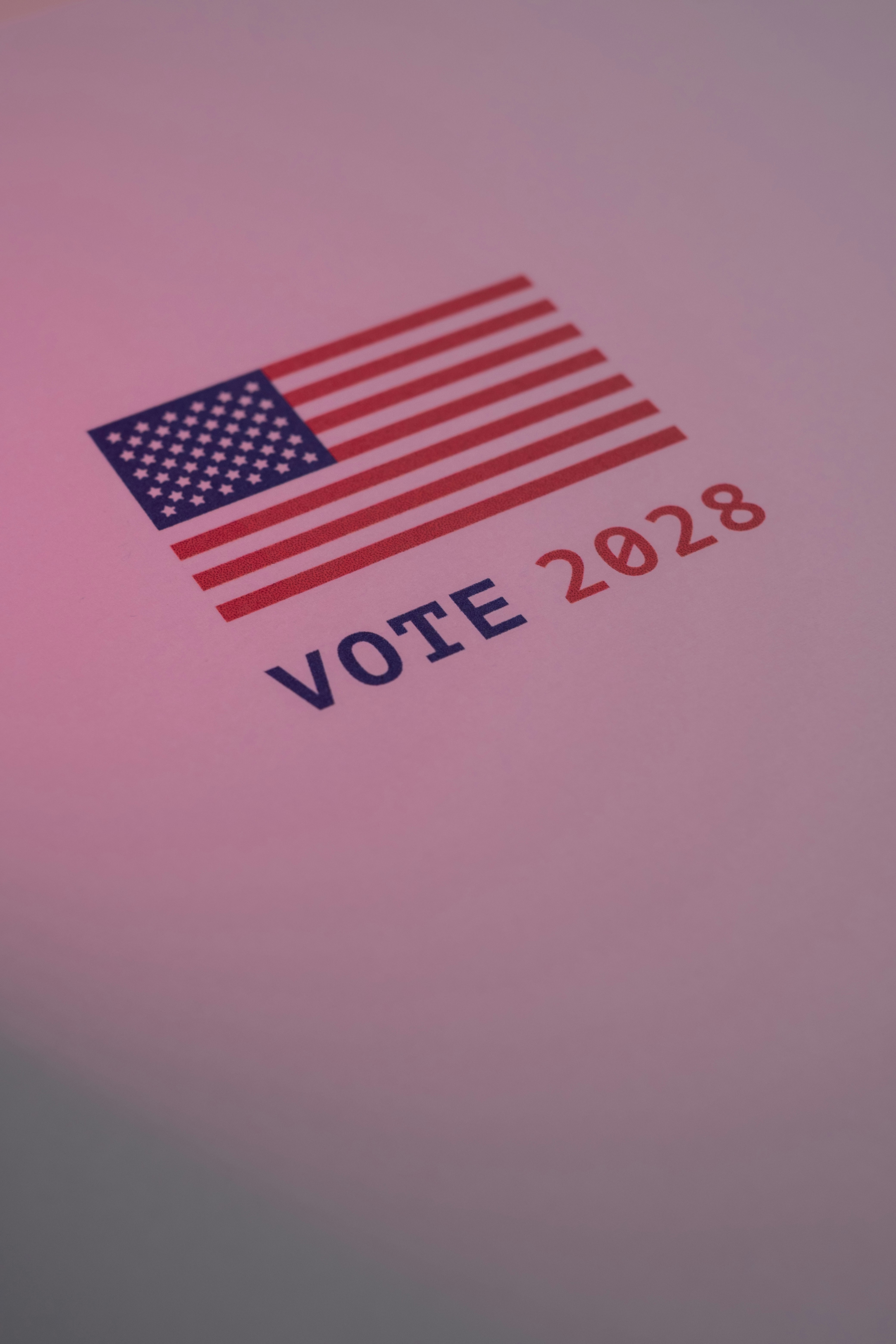 Minimalist US Presidential Election Concept with American Flag and Vote 2028 Text in Moody Red and Blue Lighting