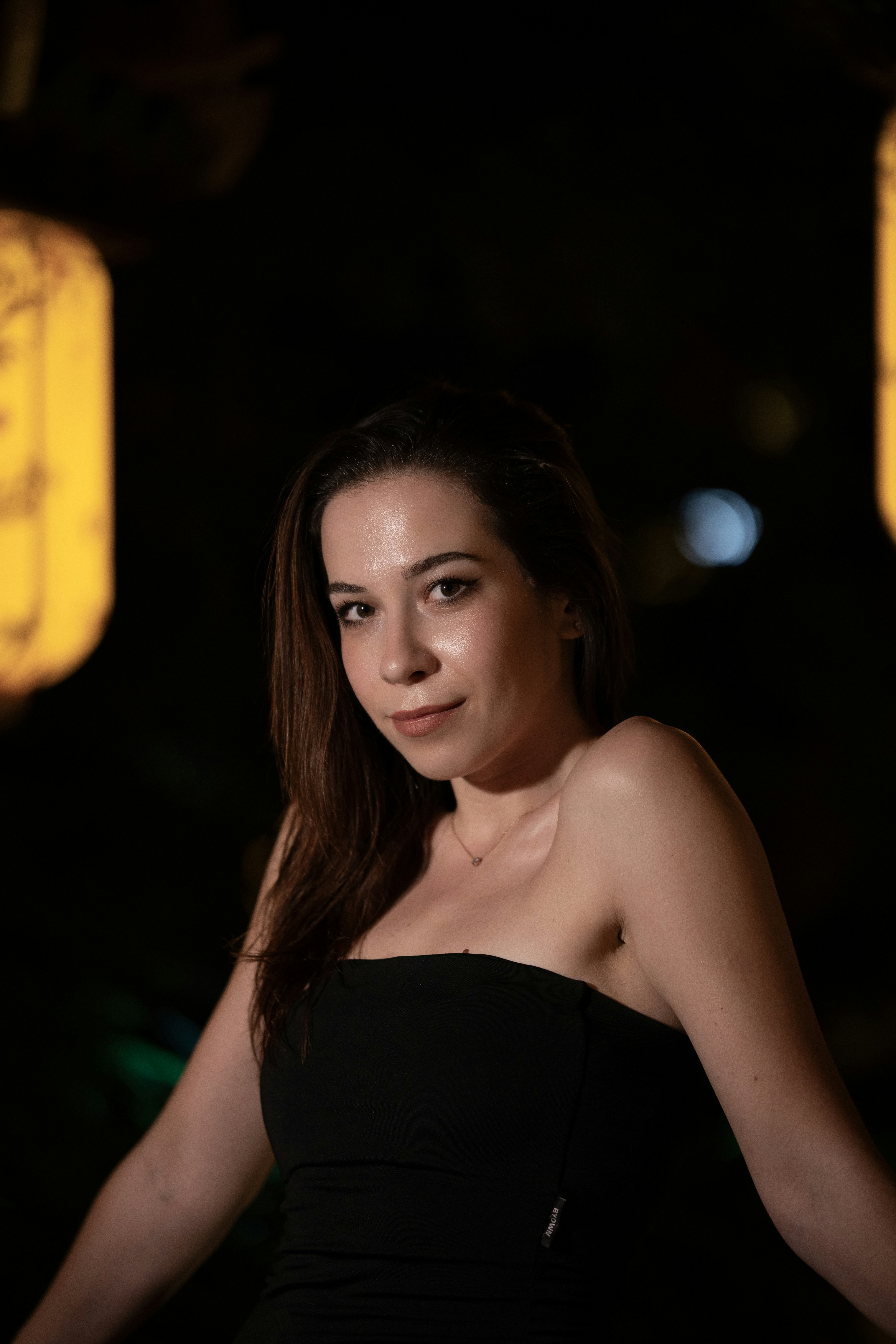 Midnight Glow: The Confident Gaze Beneath Warm Lanterns