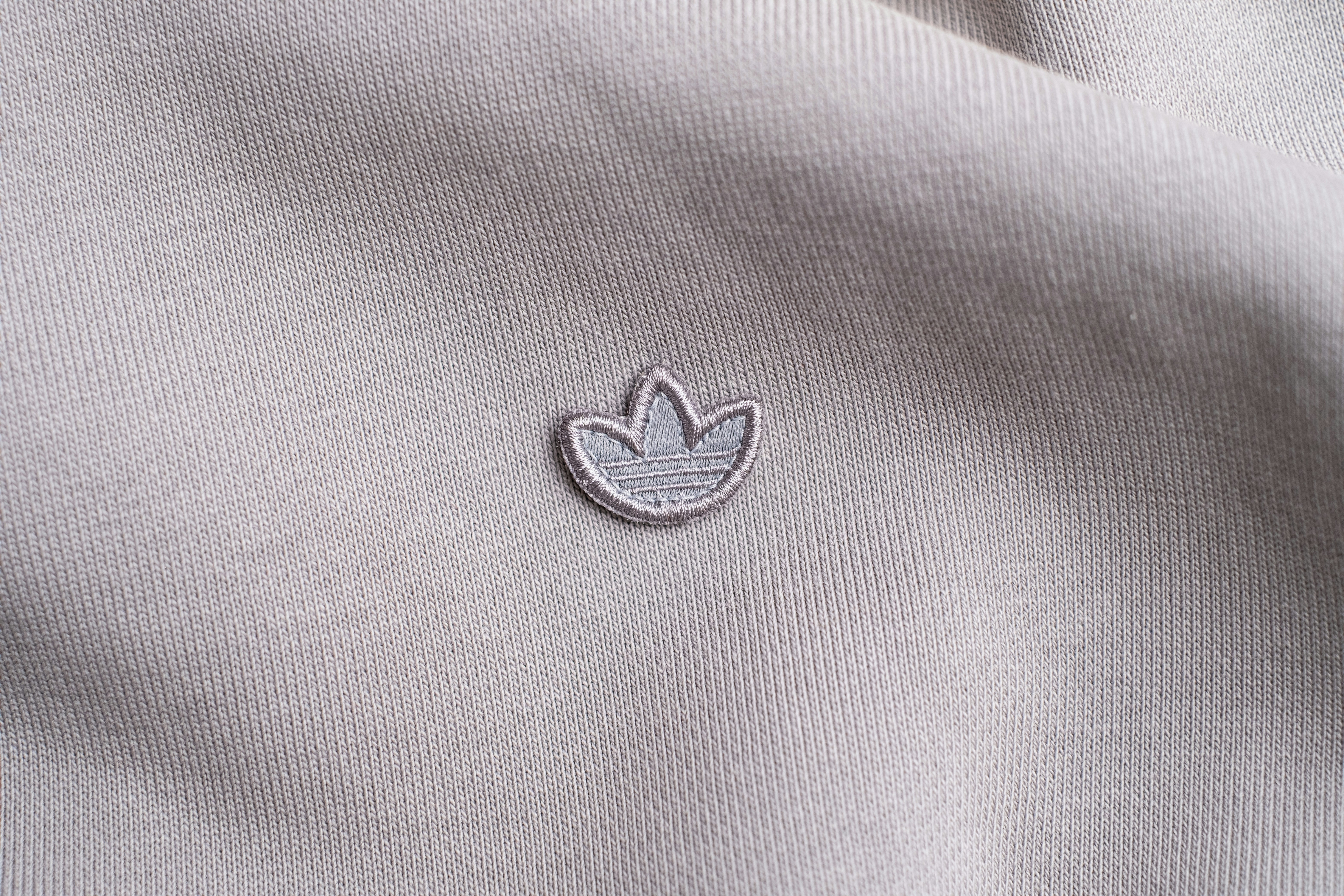 Embroidered Leaf Emblem on Soft Fabric Fold
