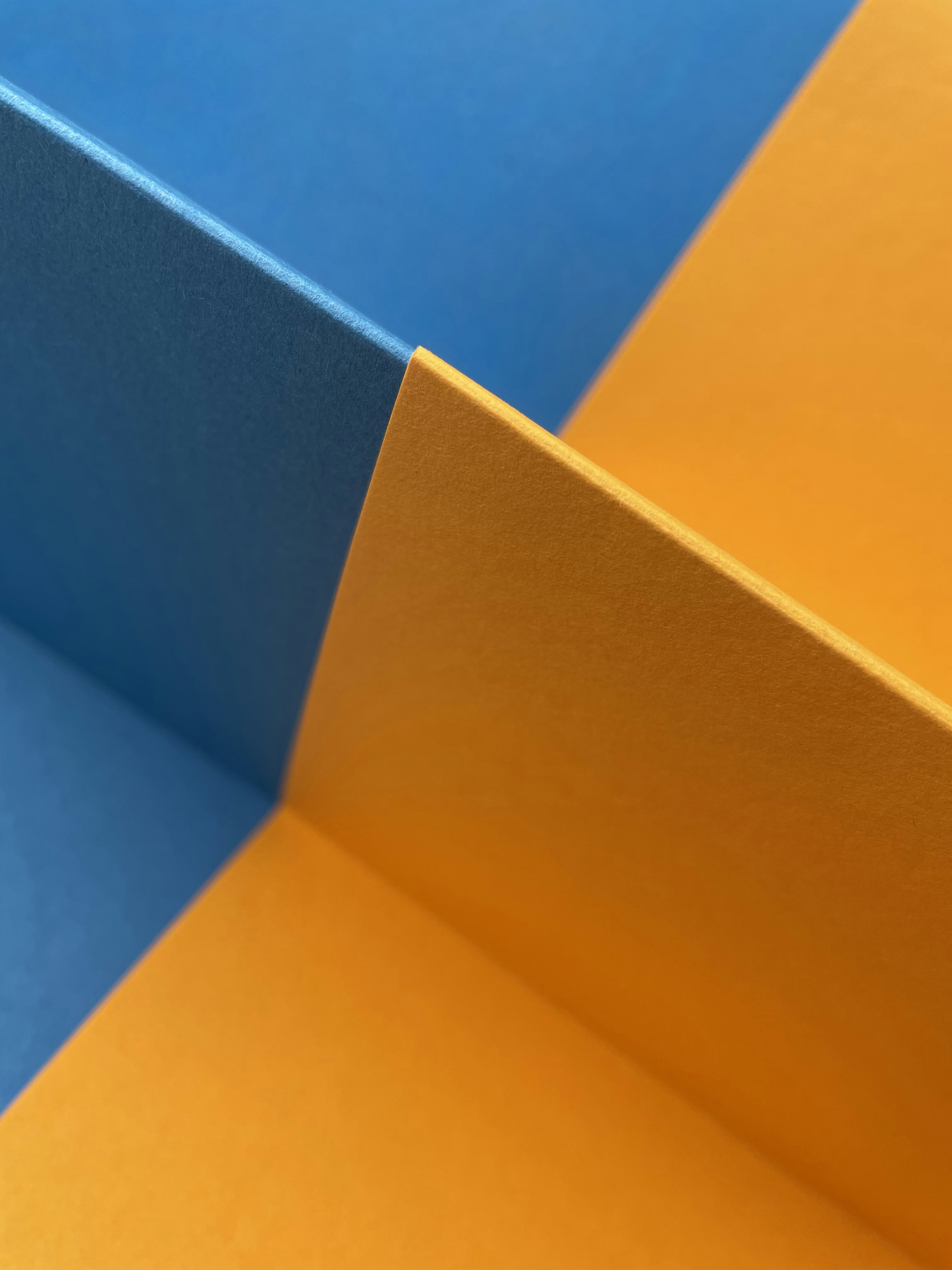 Ukraine flag. Abstract Geometric Composition of Blue and Yellow Cardstock Sheets with Minimalist Paper Texture
