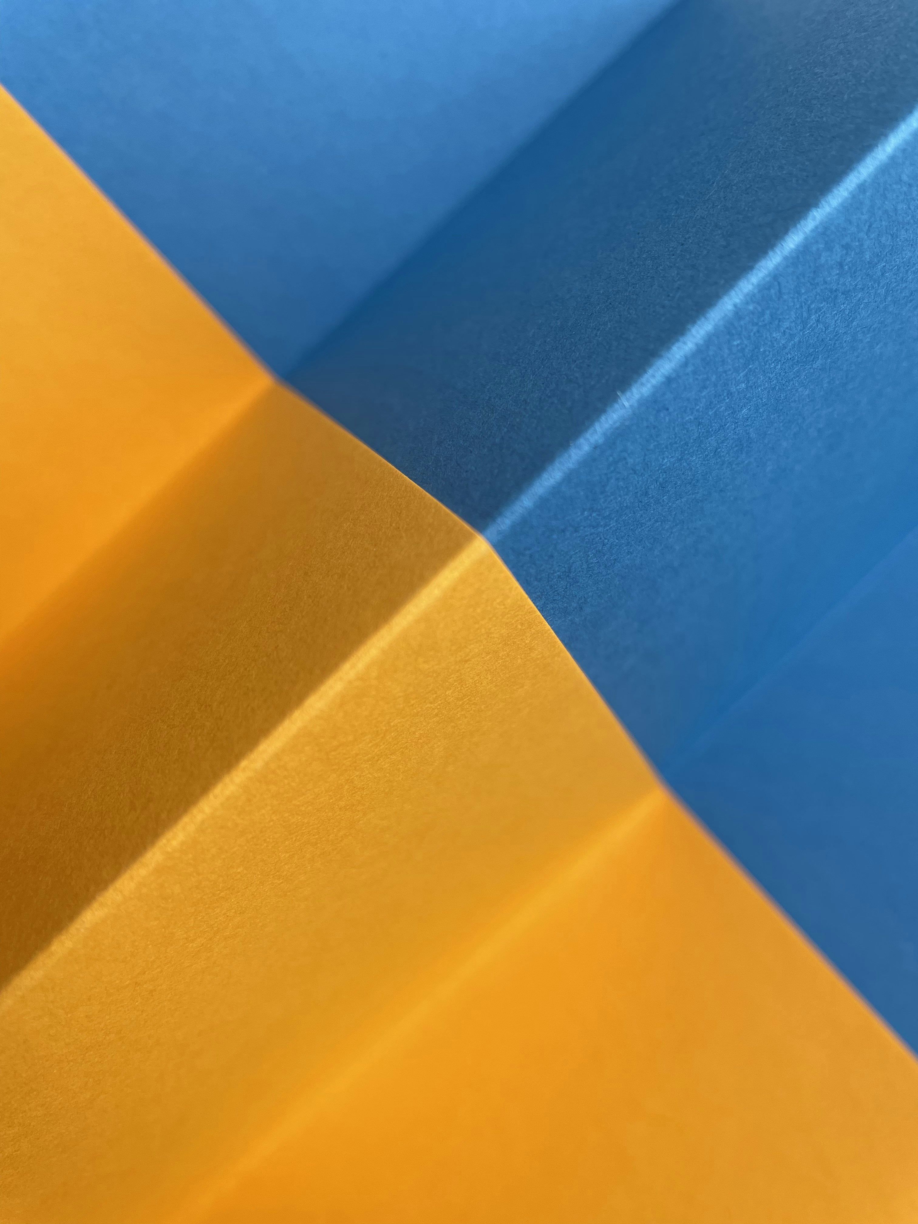 Ukraine flag. Abstract Geometric Composition of Blue and Yellow Cardstock Sheets with Minimalist Paper Texture