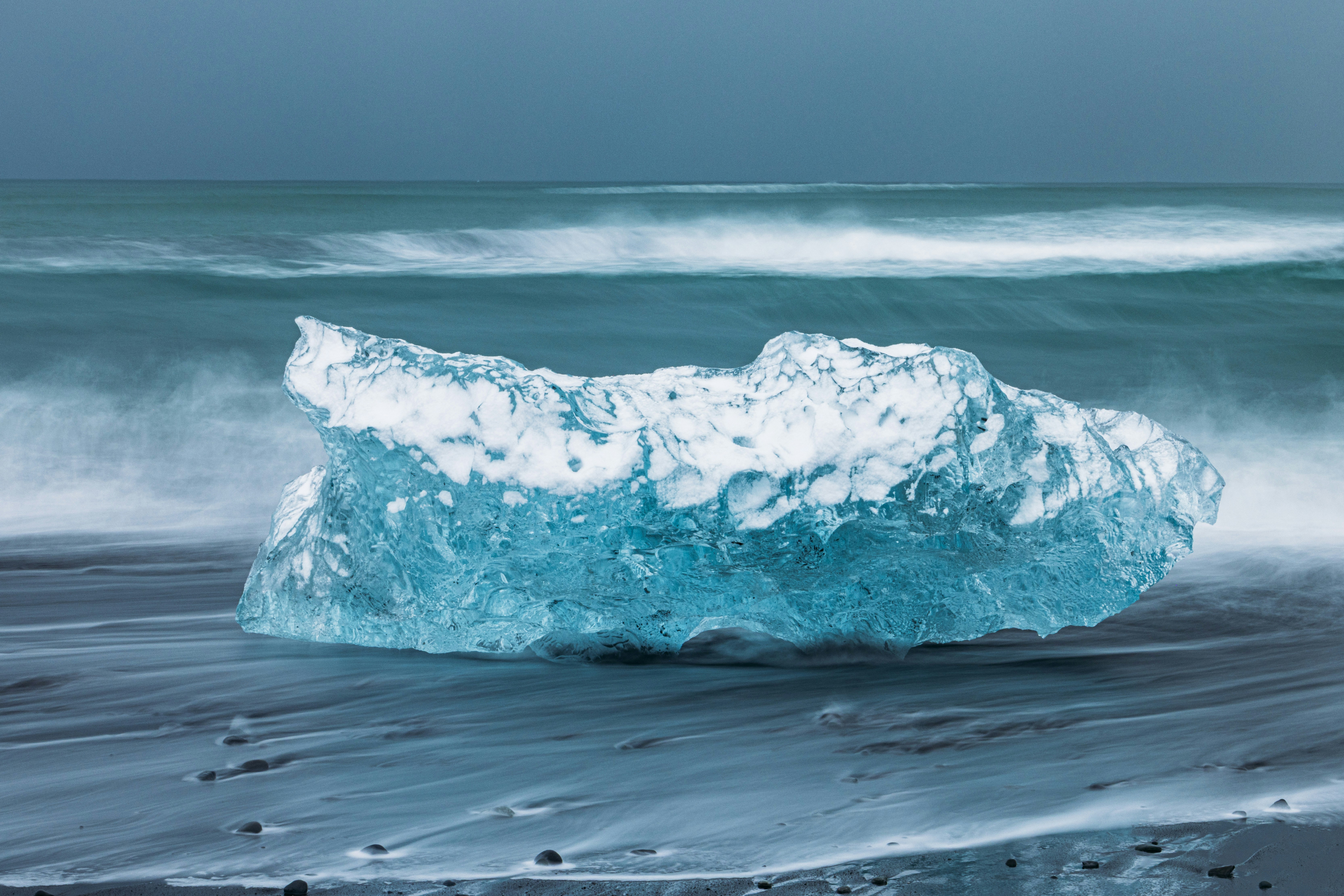 Icebound Sentinel Resting ashore under a pale horizon