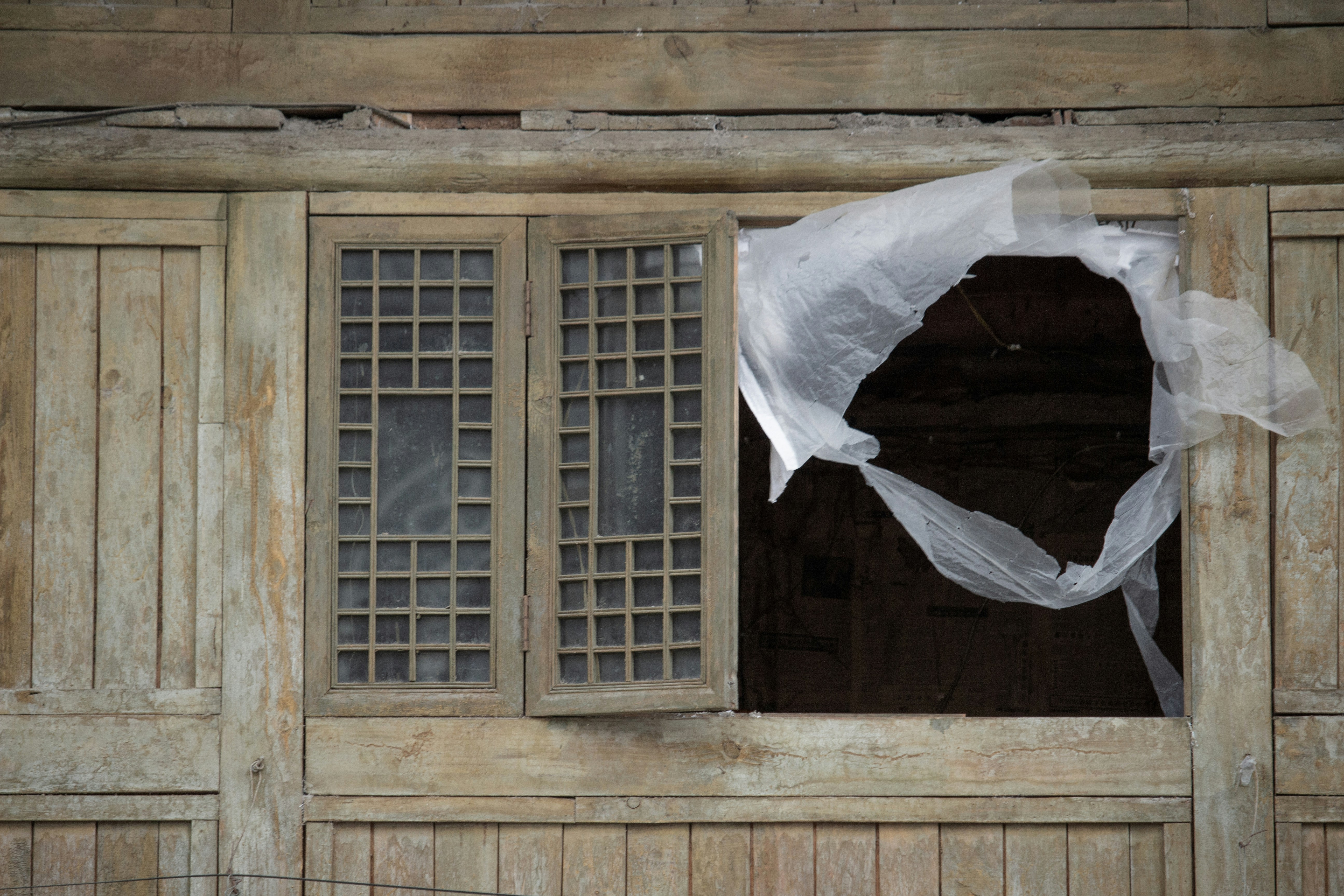 Weathered Window of Time with Torn Veil