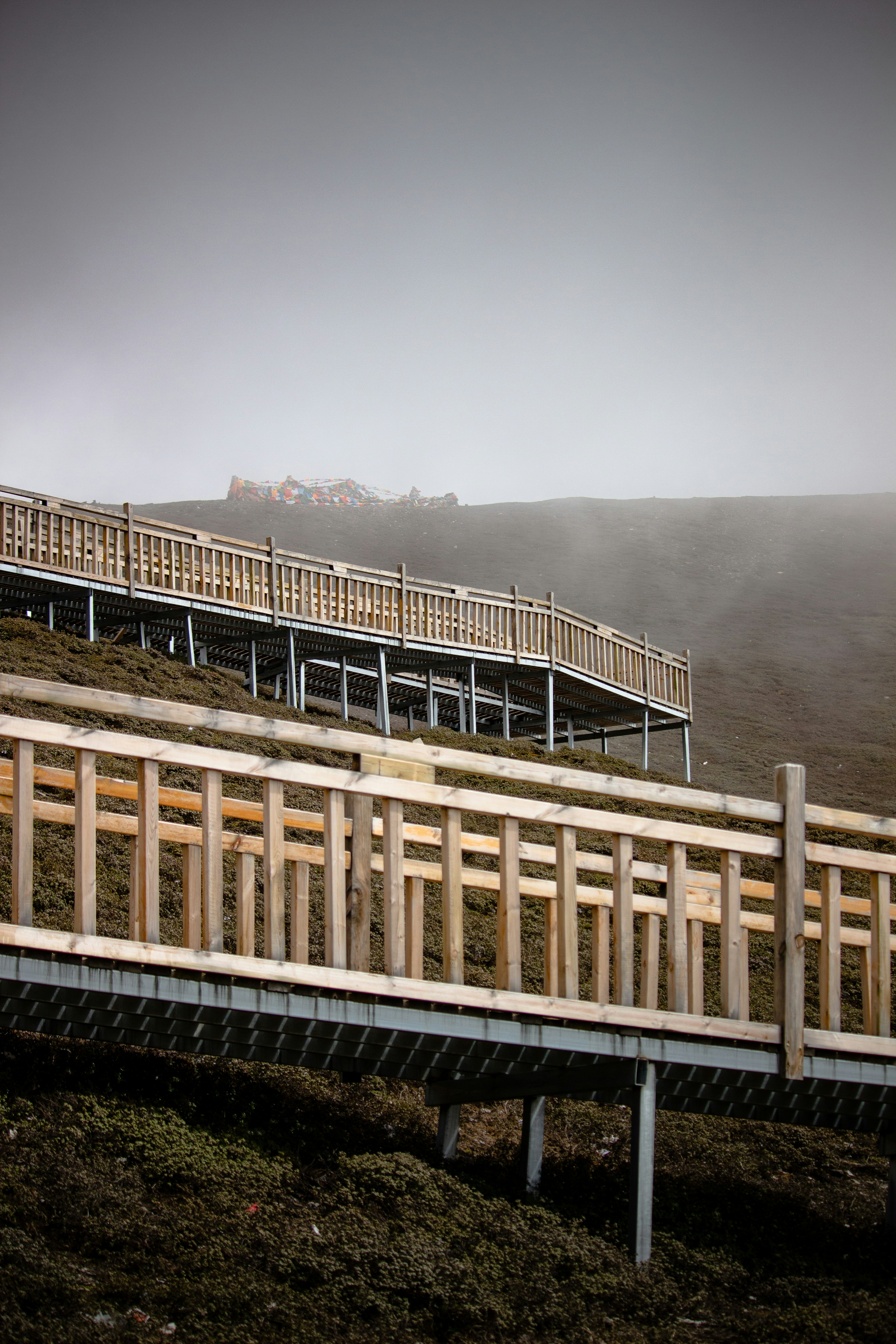 Winding Coastal Boardwalk Clings to a Misty Moor