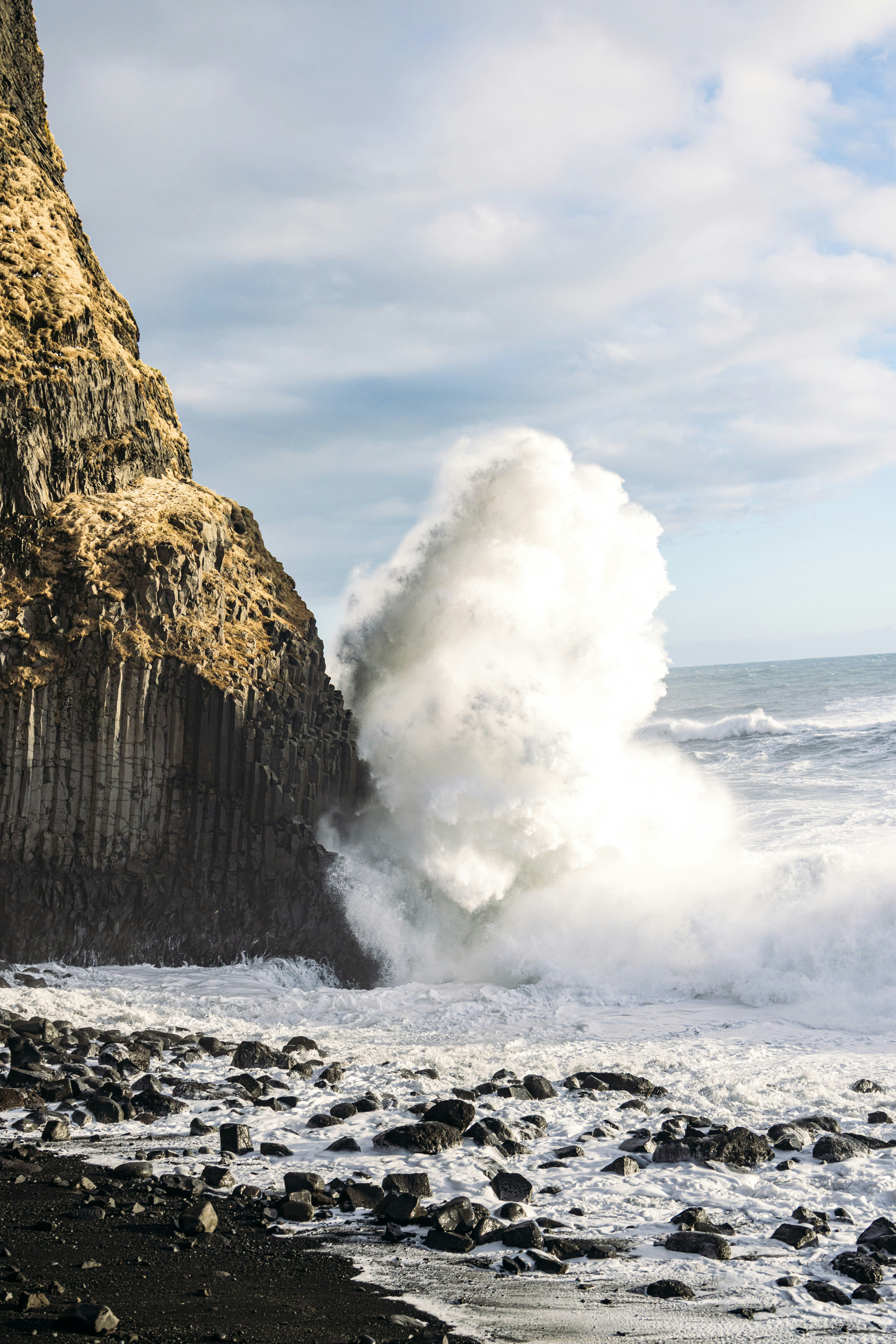 Giant Sea Spray Collides with basalt Cliff