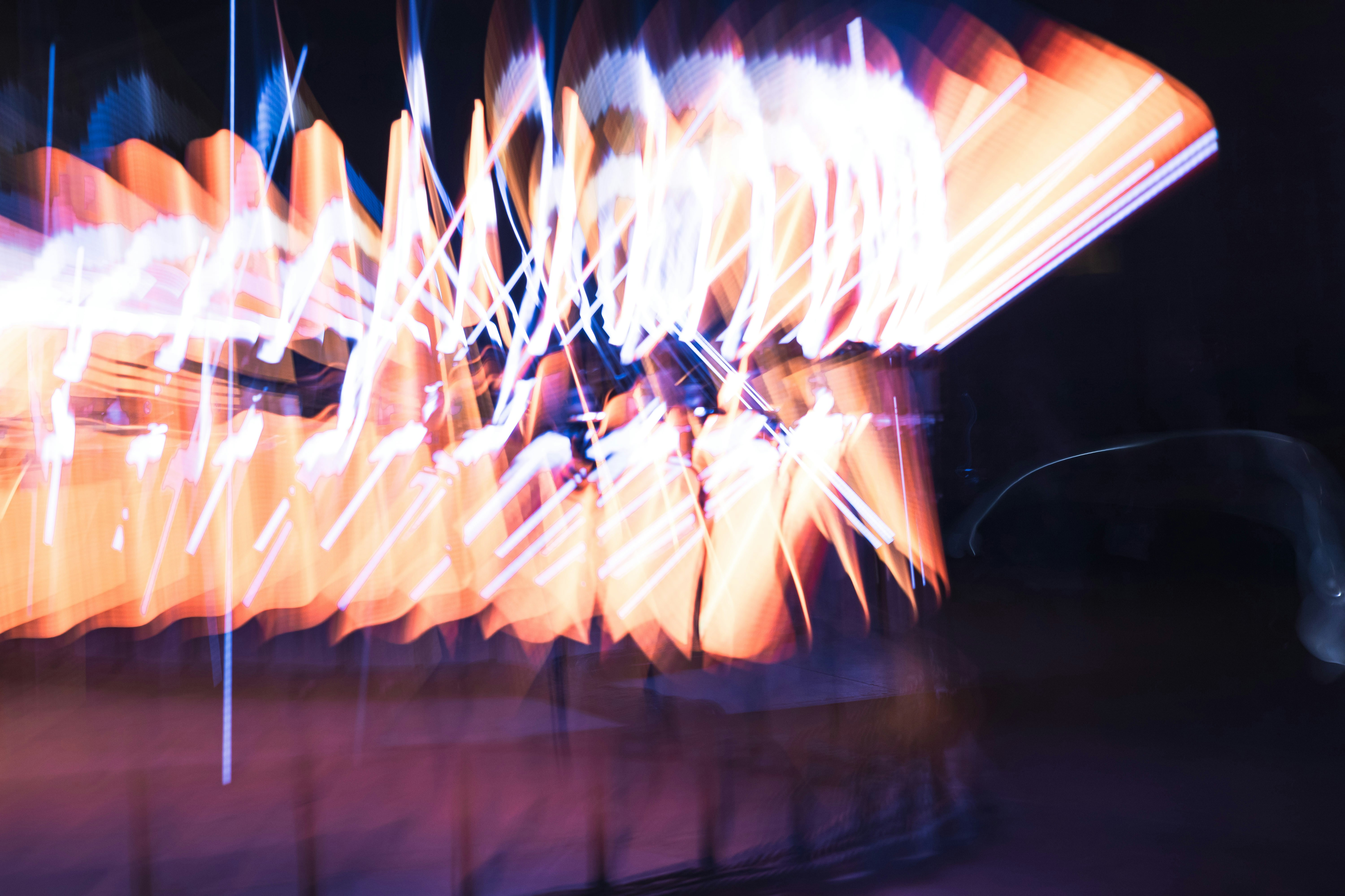 Neon Spiral: Blurred Flames in a Night Studio